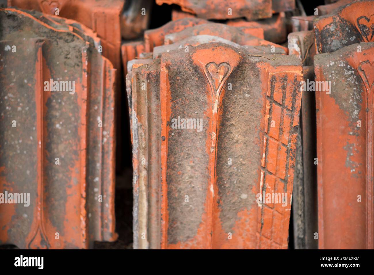 Poster with old roof tiles with heart image, reuse of things, repair or ...