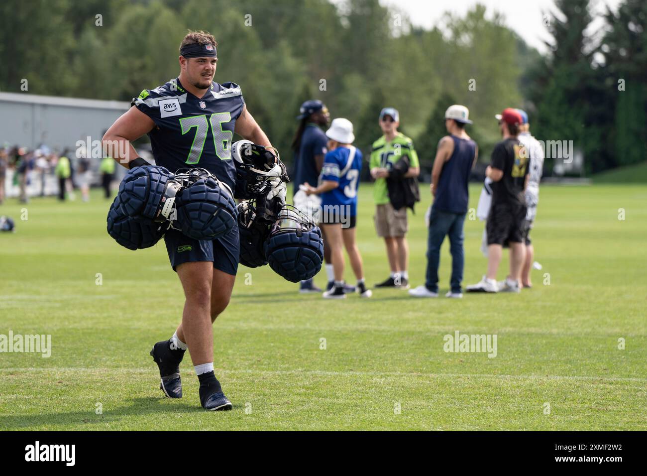 Seattle Seahawks offensive lineman Garret Greenfield carries a load of ...