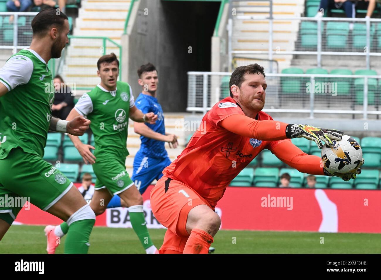 Goalkeeper stuart mckenzie of peterhead foils martin boyle of hibernian ...