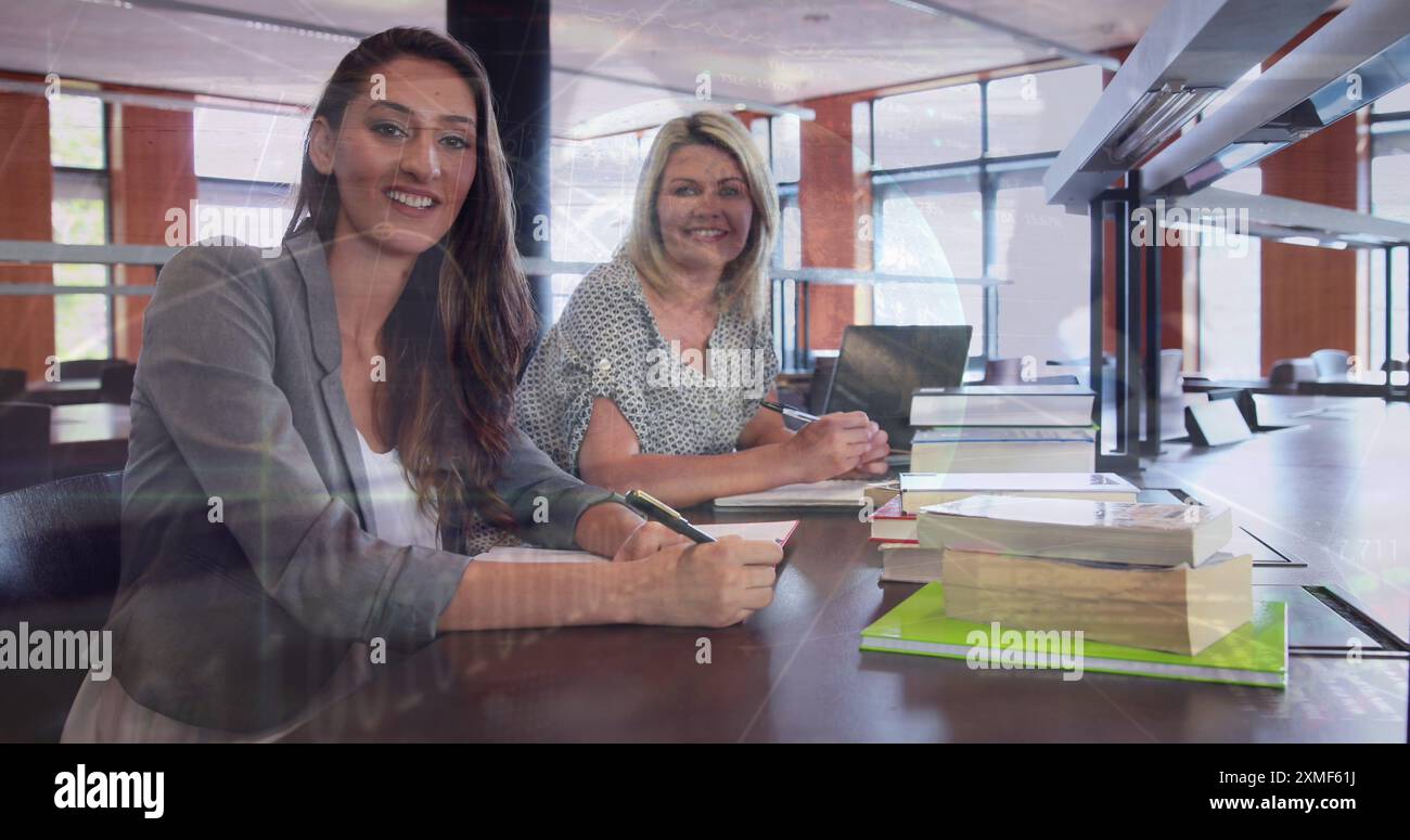 Image of globe and programming language over smiling caucasian teachers ...