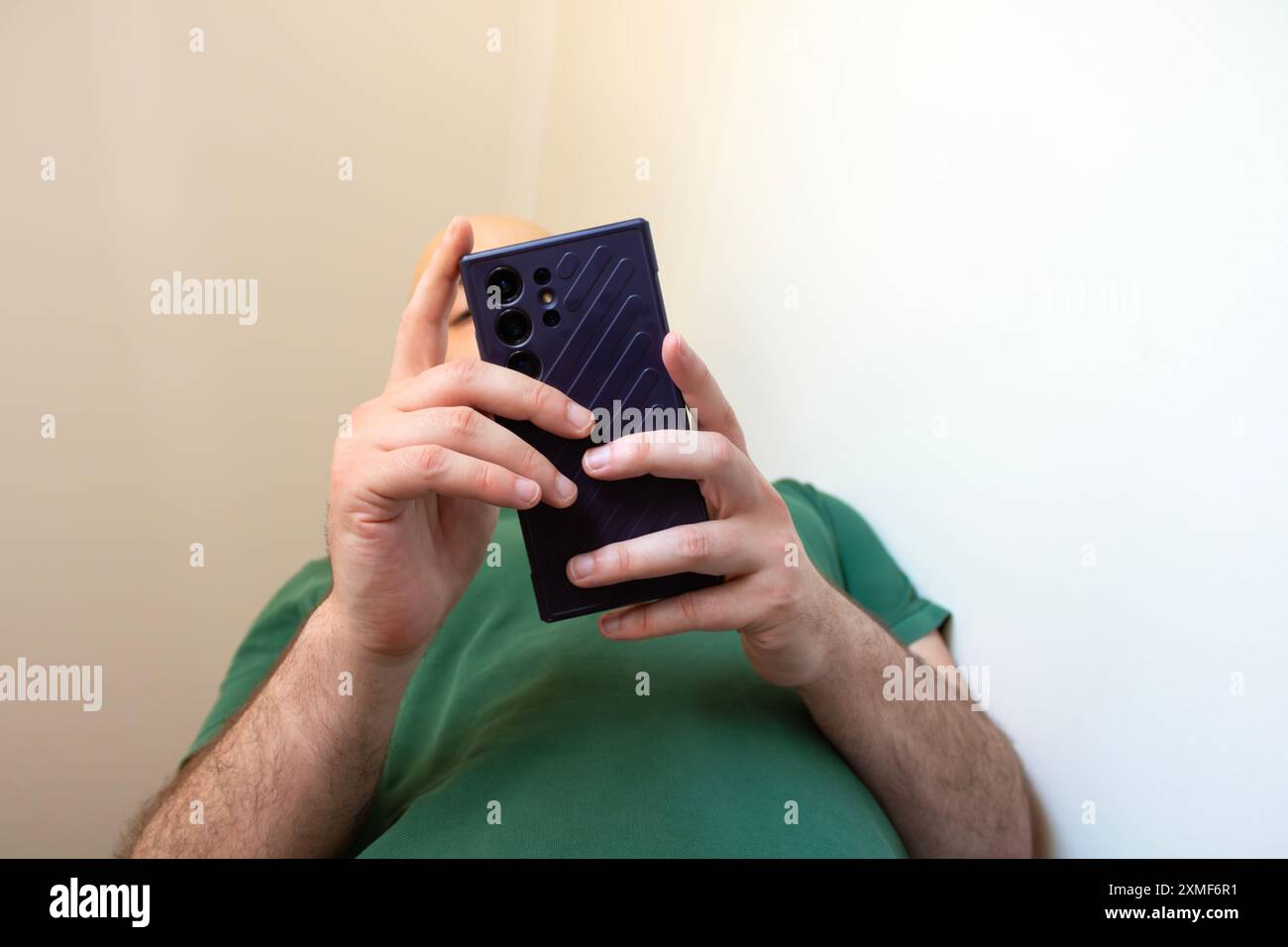 Man using new mobile phone, holding the device in front of his face ...