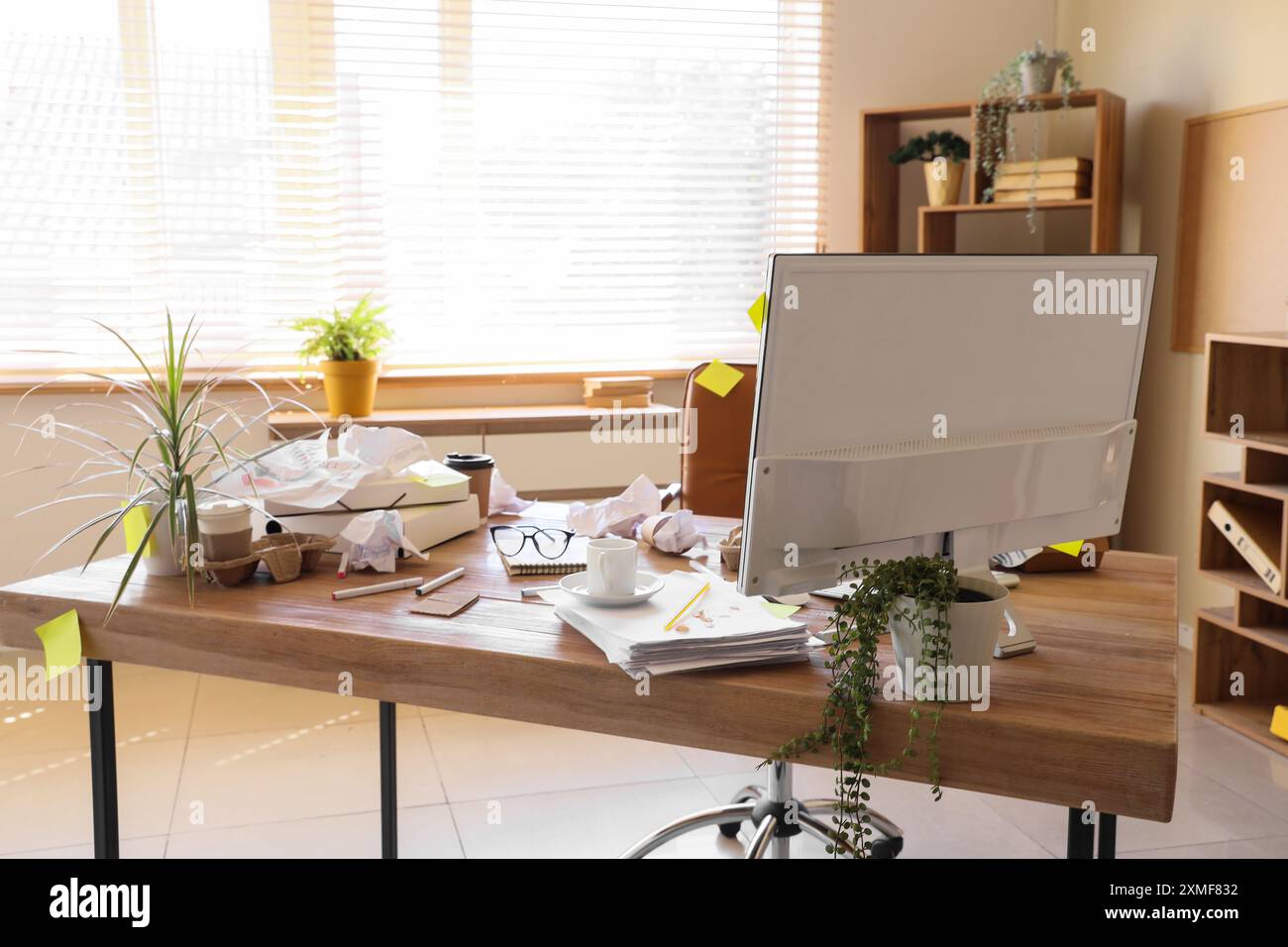 Messy workplace with computer and garbage in office Stock Photo - Alamy