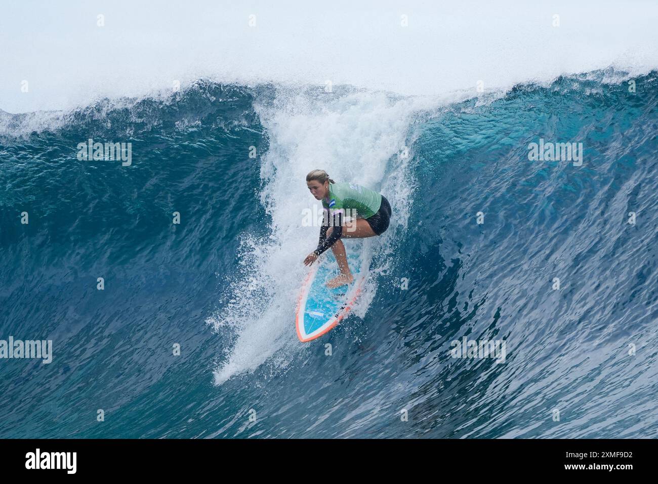Candelaria Resano, of Nicaragua, surfs during the first round of the ...