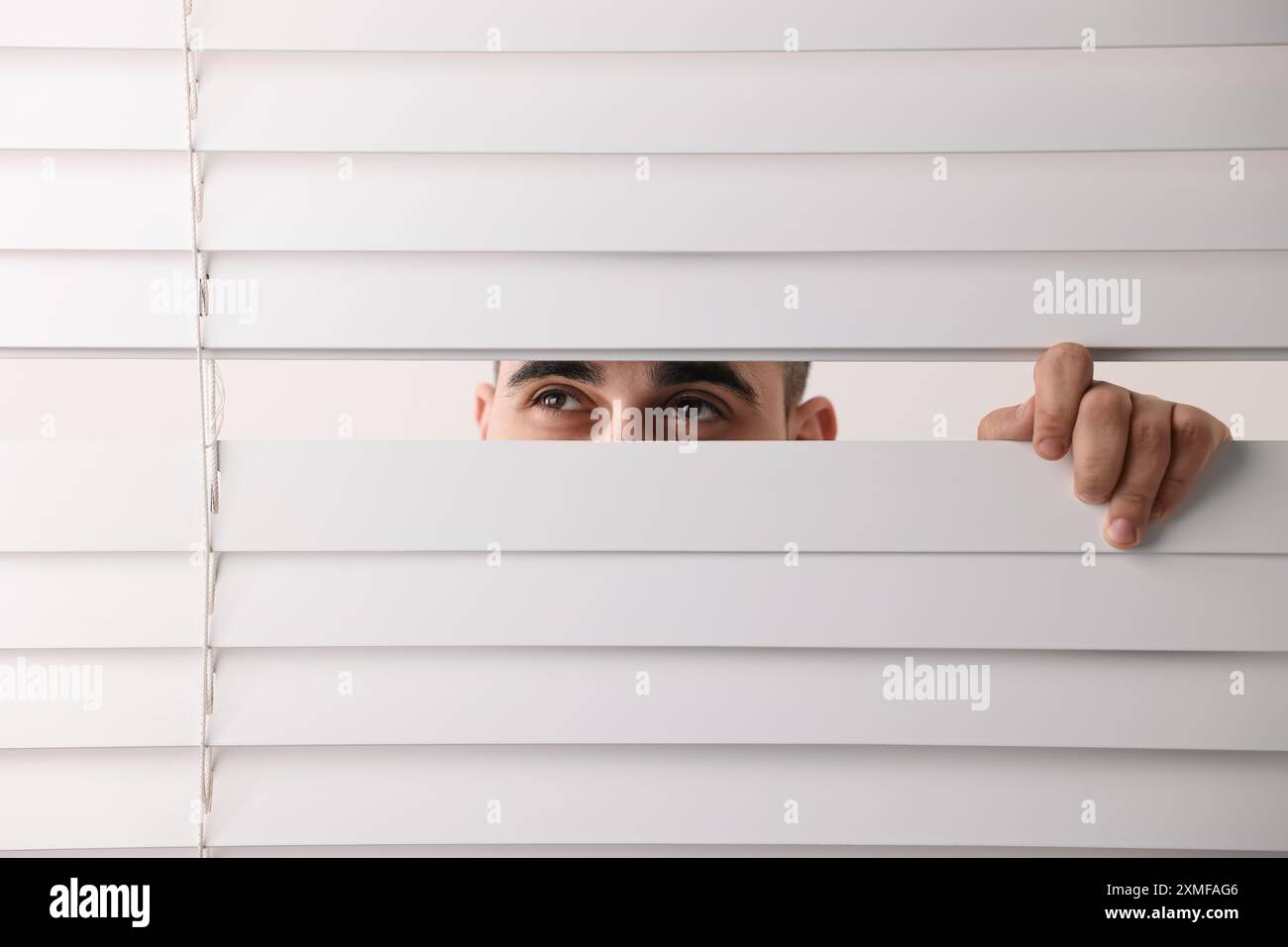 Man peeping through windows hi-res stock photography and images - Alamy