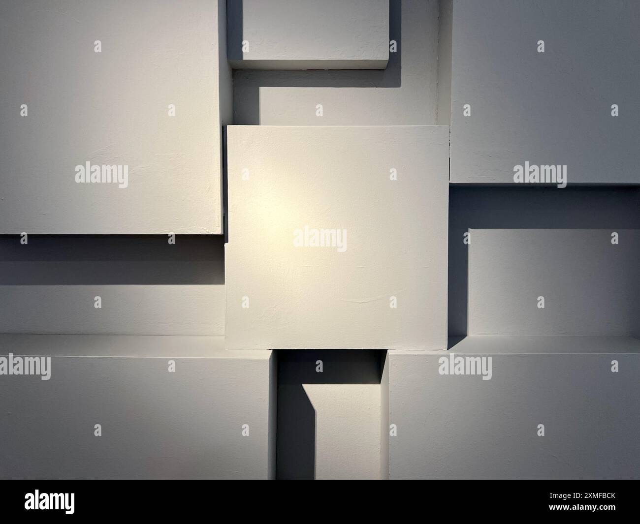 Square wall panels cast shadows under hard light Stock Photo - Alamy
