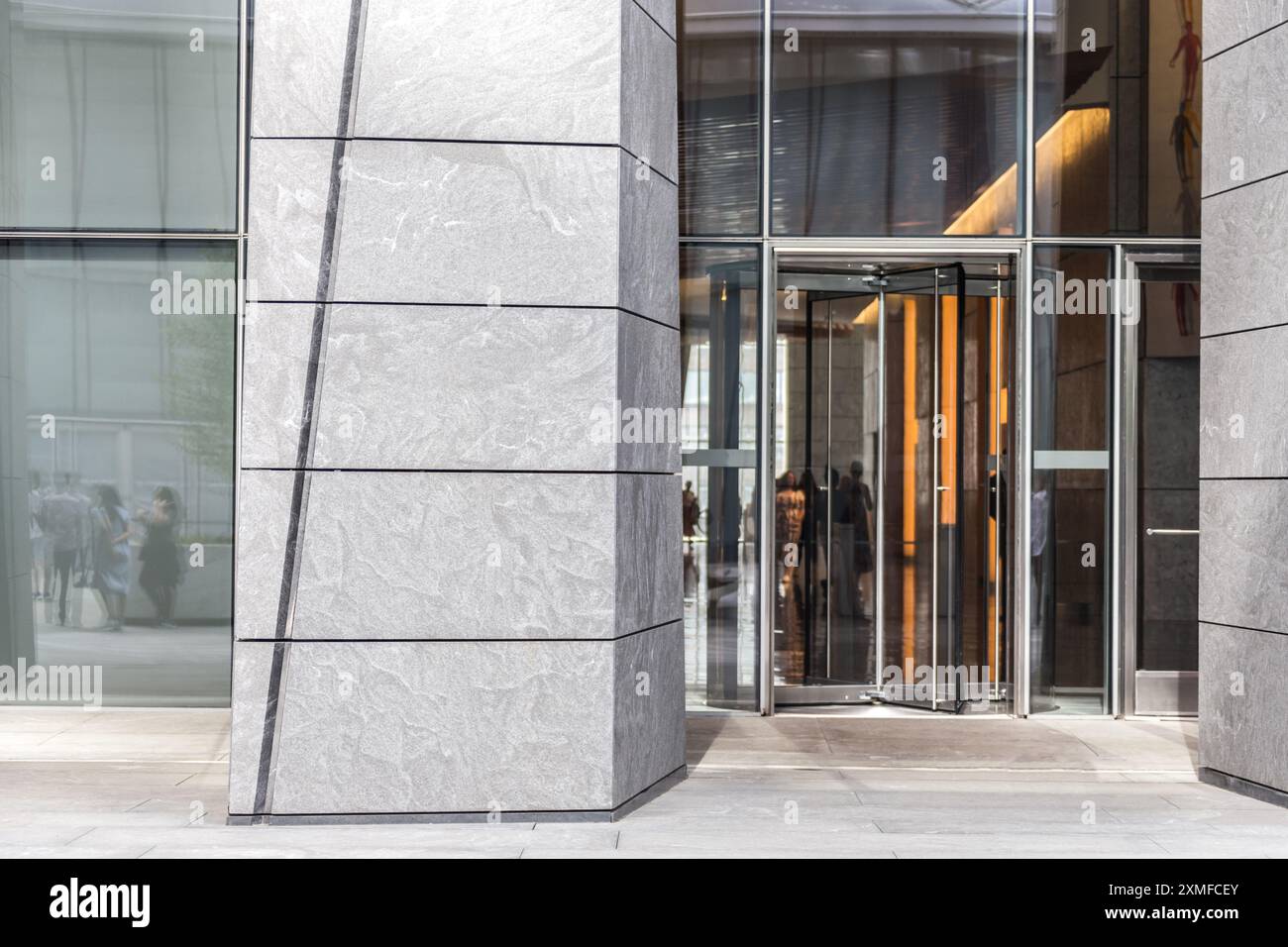 Concrete facade of an office building entrance. Empty space for logo or ...