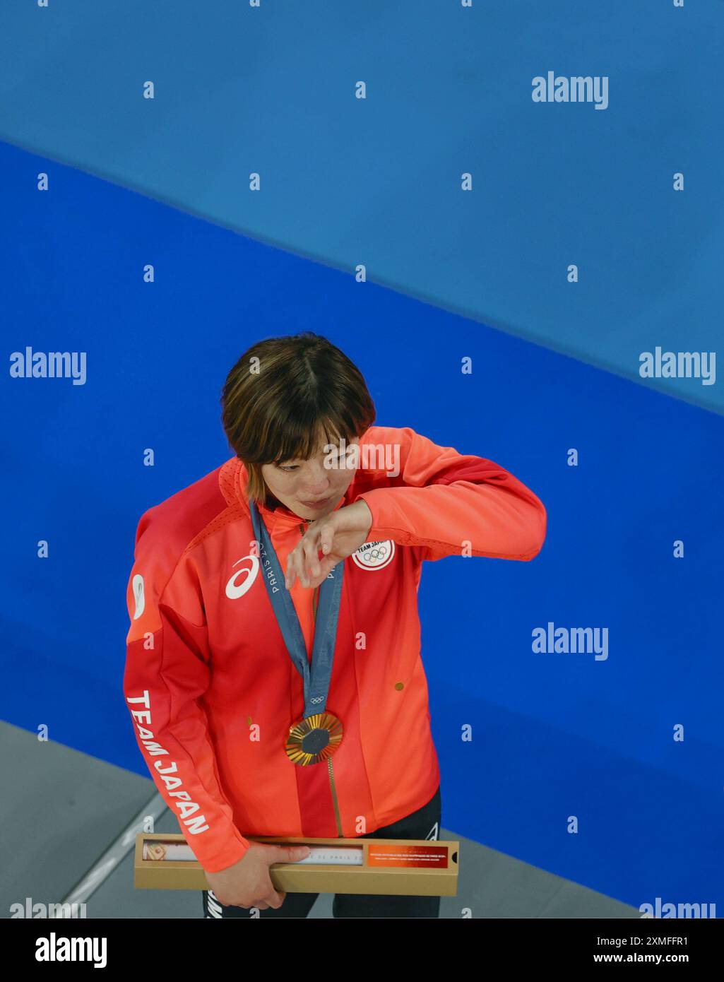 Japan's Natsumi Tsunoda sheds a tear during the medal ceremony after ...