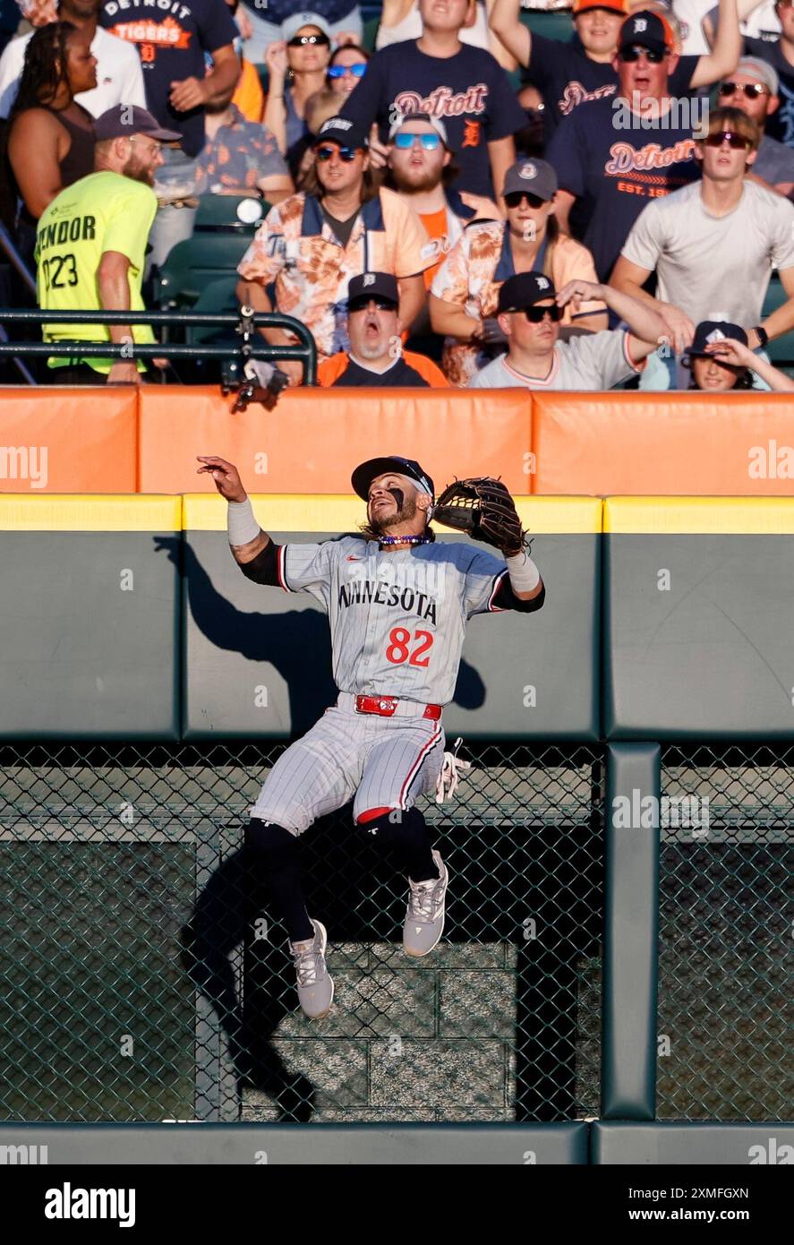 Minnesota Twins' Austin Martin (82) goes up against the left field wall ...