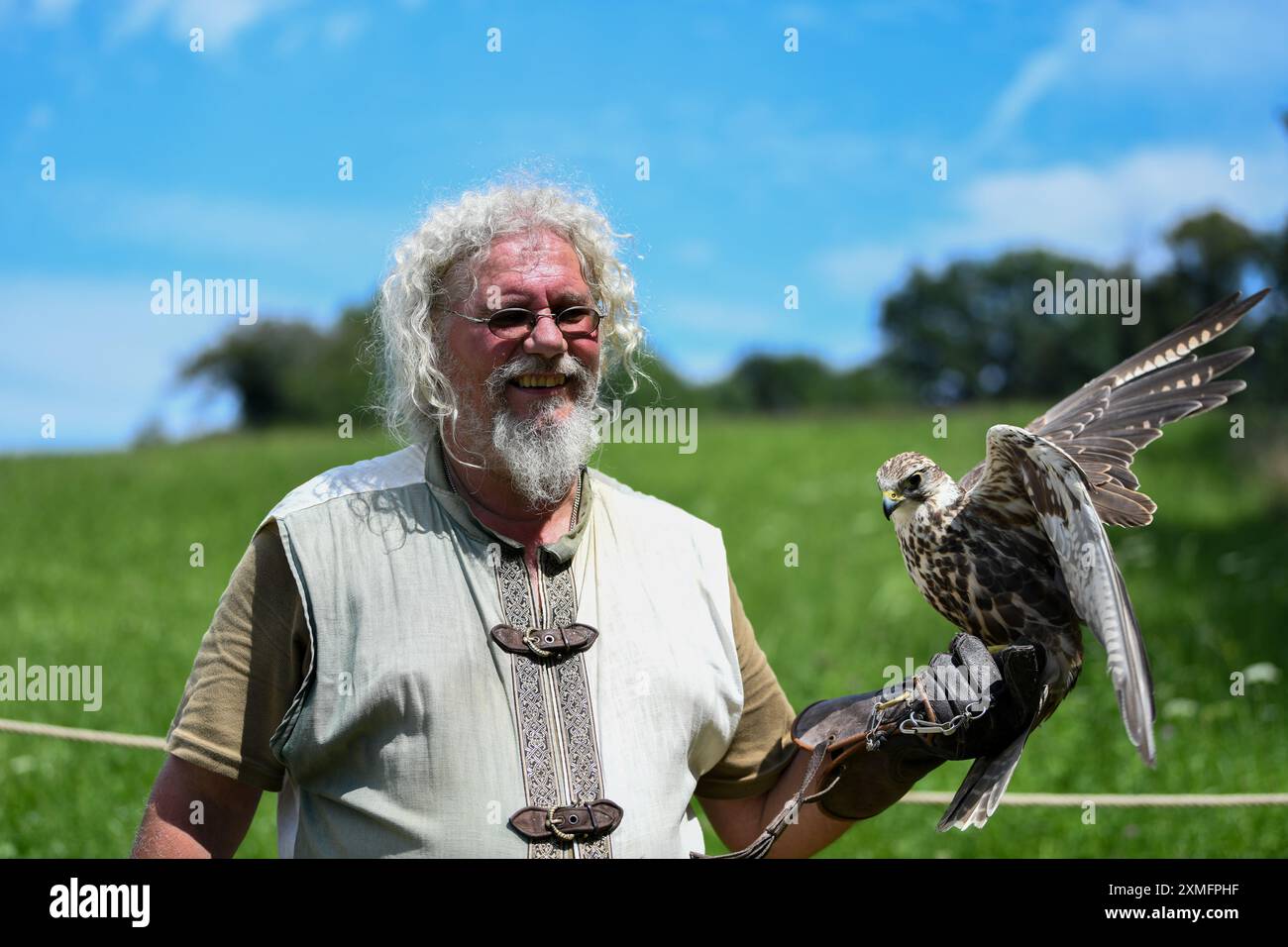 Munchenwiler. 27th July, 2024. A man in folk costume demonstrates ...