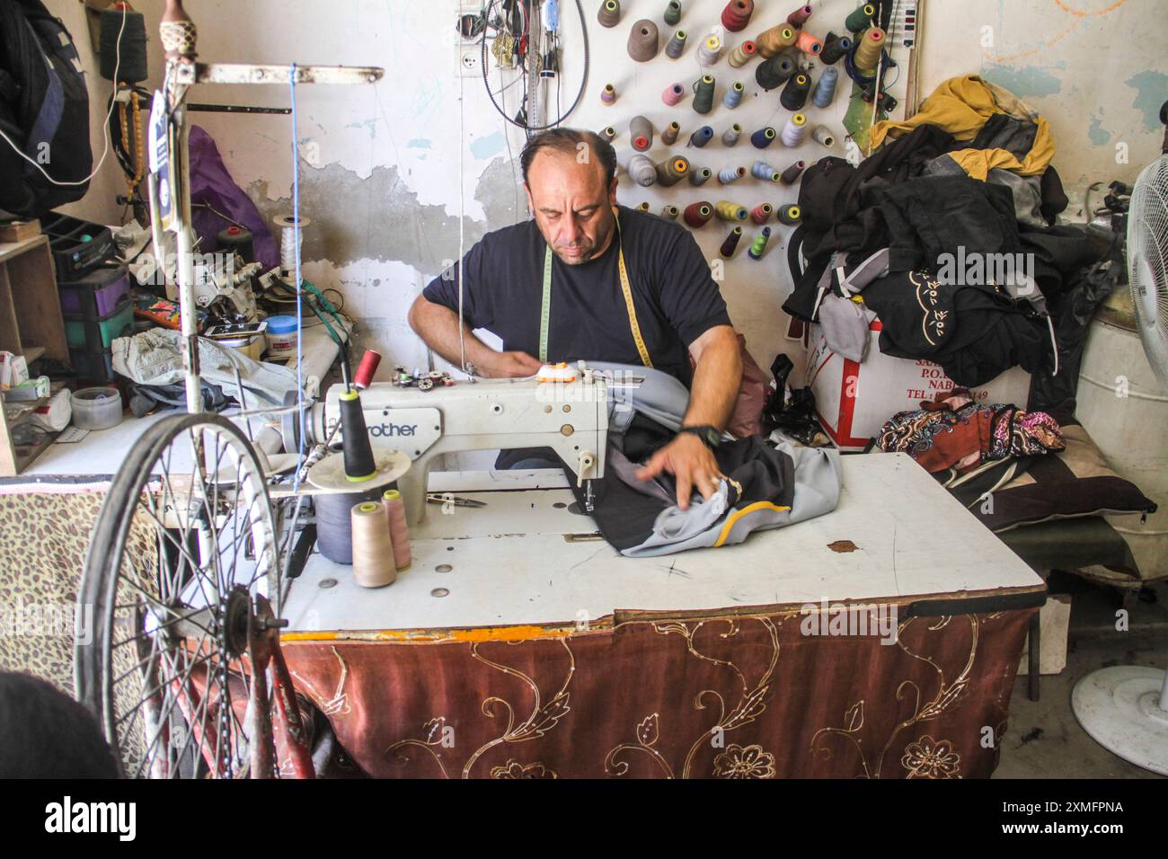 Gaza. 27th July, 2024. Mohammed Sqad, a Palestinian tailor based in ...