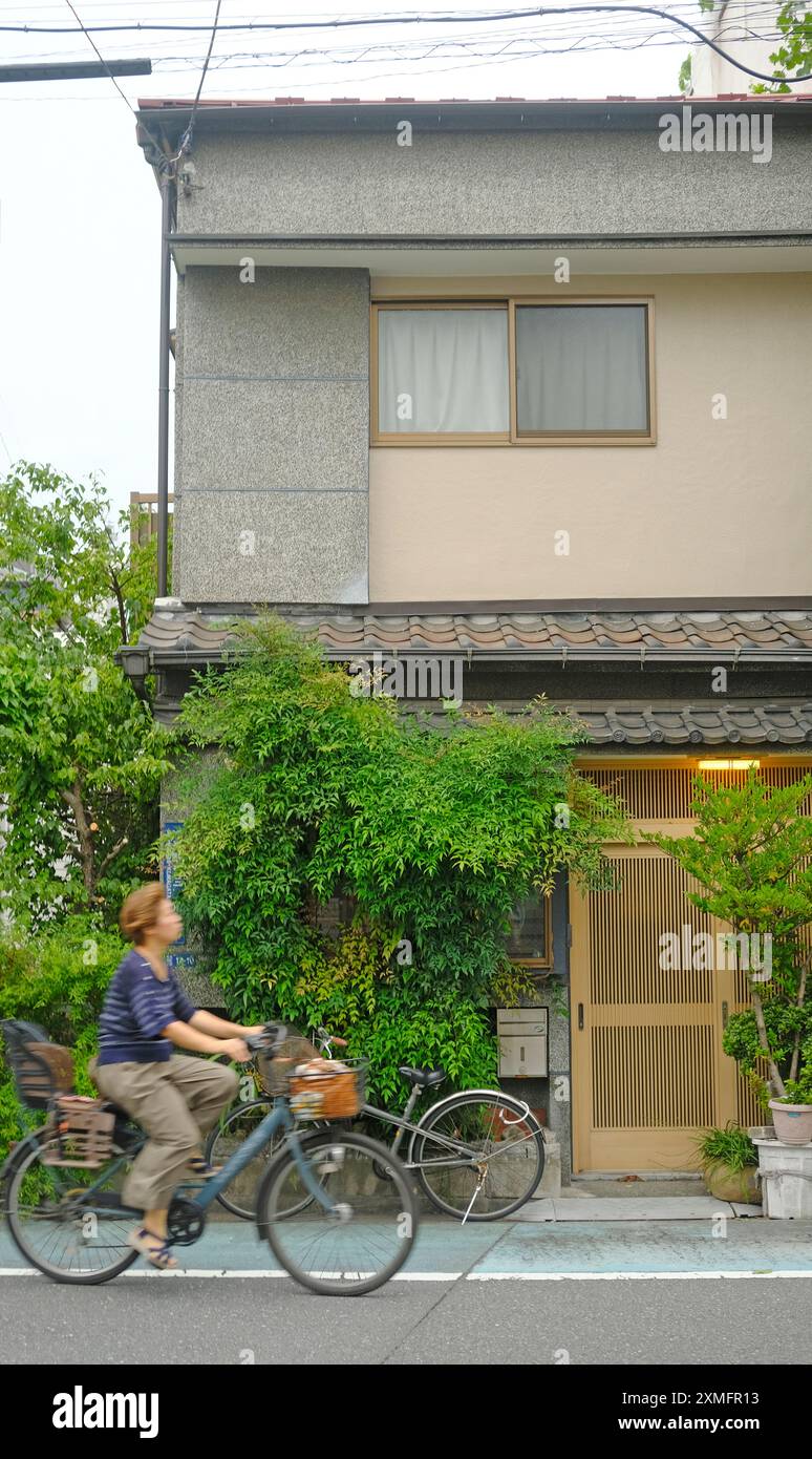 The vertical Japanese residential building with retro style bicycle and ...