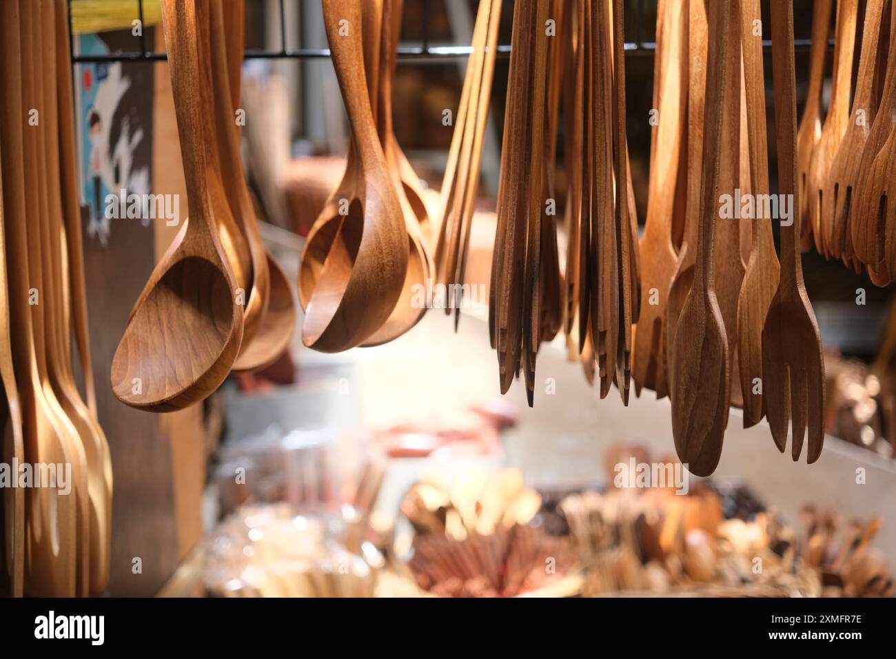 The close-up traditional wooden spoons, forks and kitchen utensils in ...
