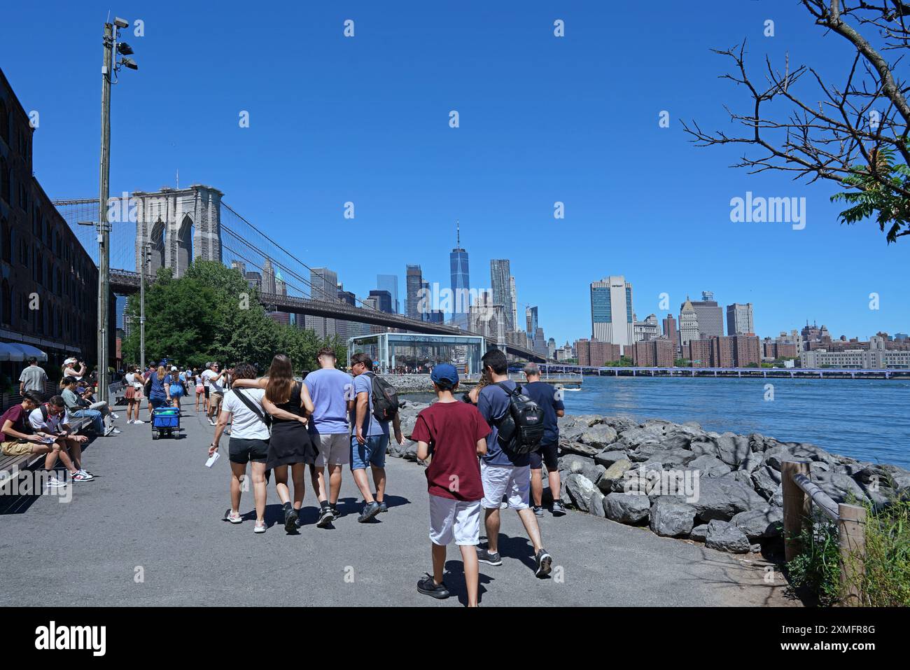 Brooklyn waterfront park, with path going under the Brooklyn Bridge ...