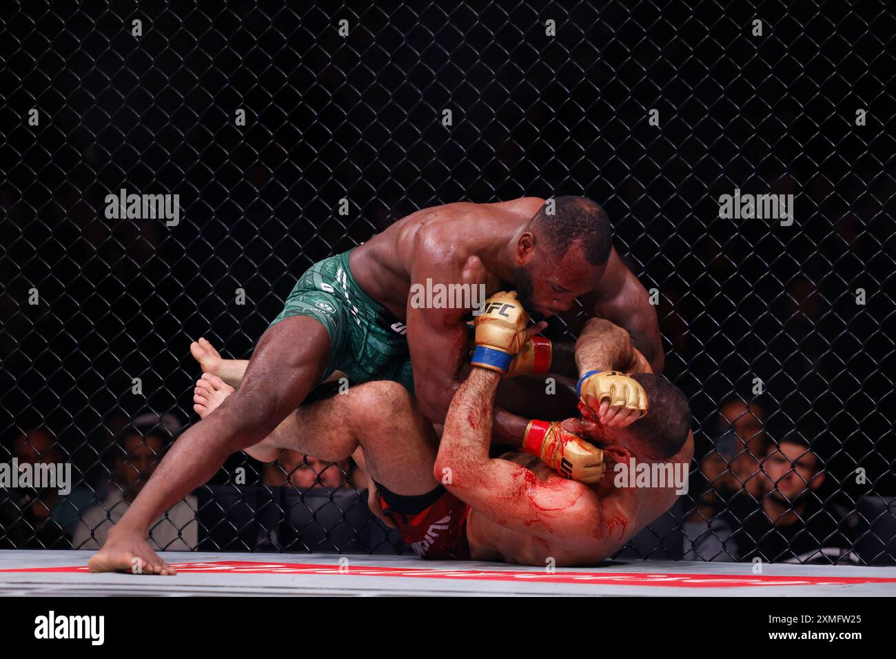 Leon Edwards and Belal Muhammad grapple during the Welterweight title ...