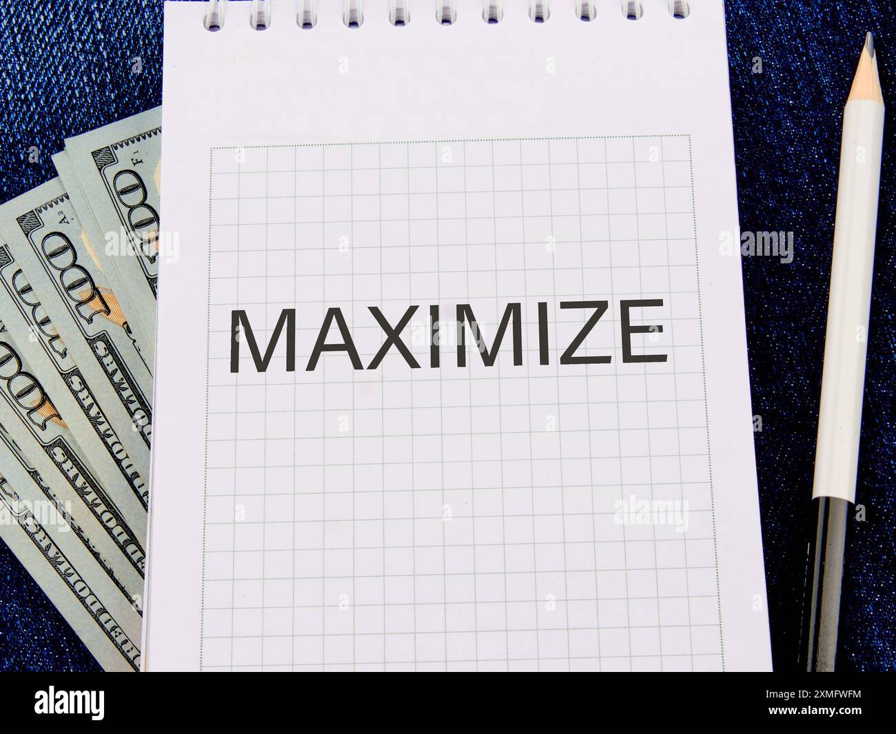 Word Maximize in a notebook in a composition with American hundred ...