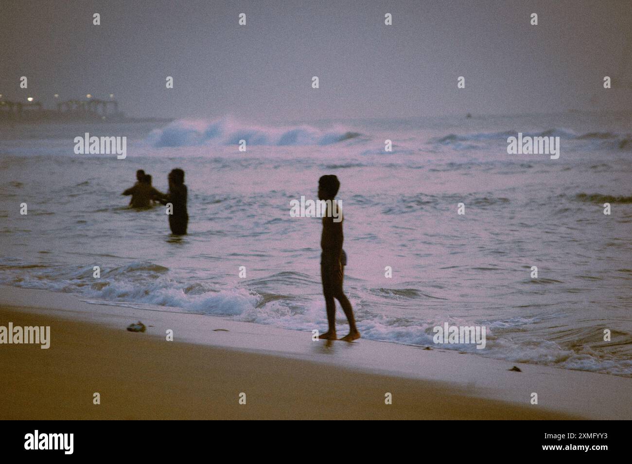 lonely boy wandering in beach Stock Photo - Alamy