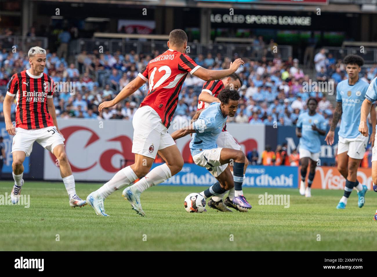 Oscar Bobb (52) of Manchester City controls ball during friendly match against AC Milan at ...