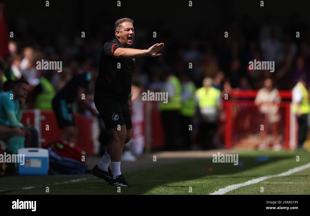 Crawley Town Manager Scott Lindsey gestures from the dug-outs Stock ...