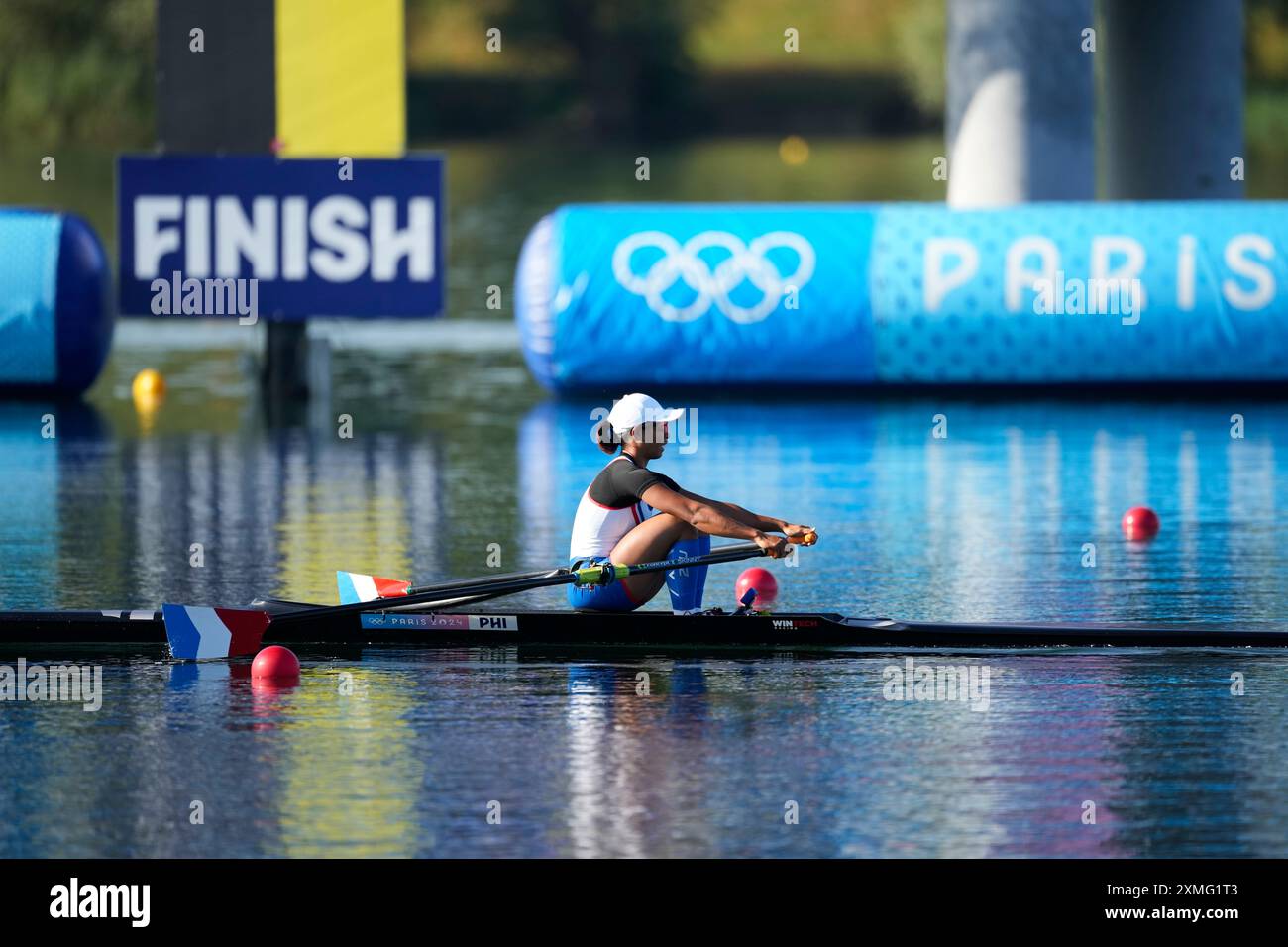 Joanie Delgaco, of the Philippines, crosses the finish line in the ...