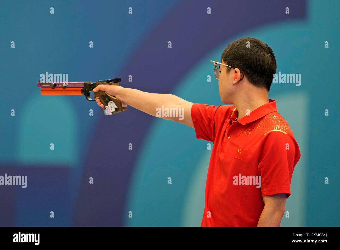 China's Xie Yu competes in the 10m air pistol men's final at the 2024 ...