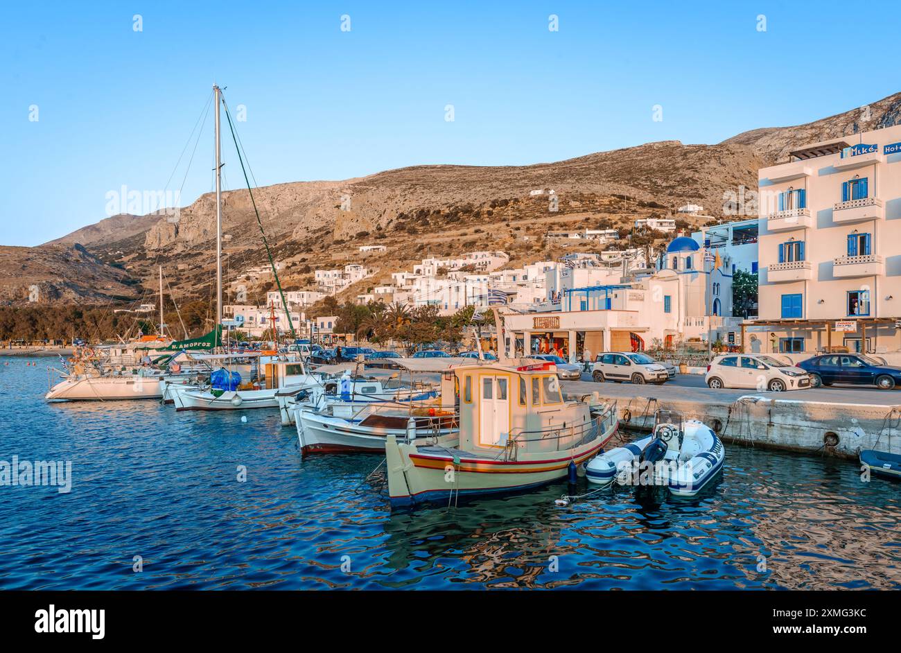 The waterfront of Aegiali in the sunset. Aigiali is a picturesque ...