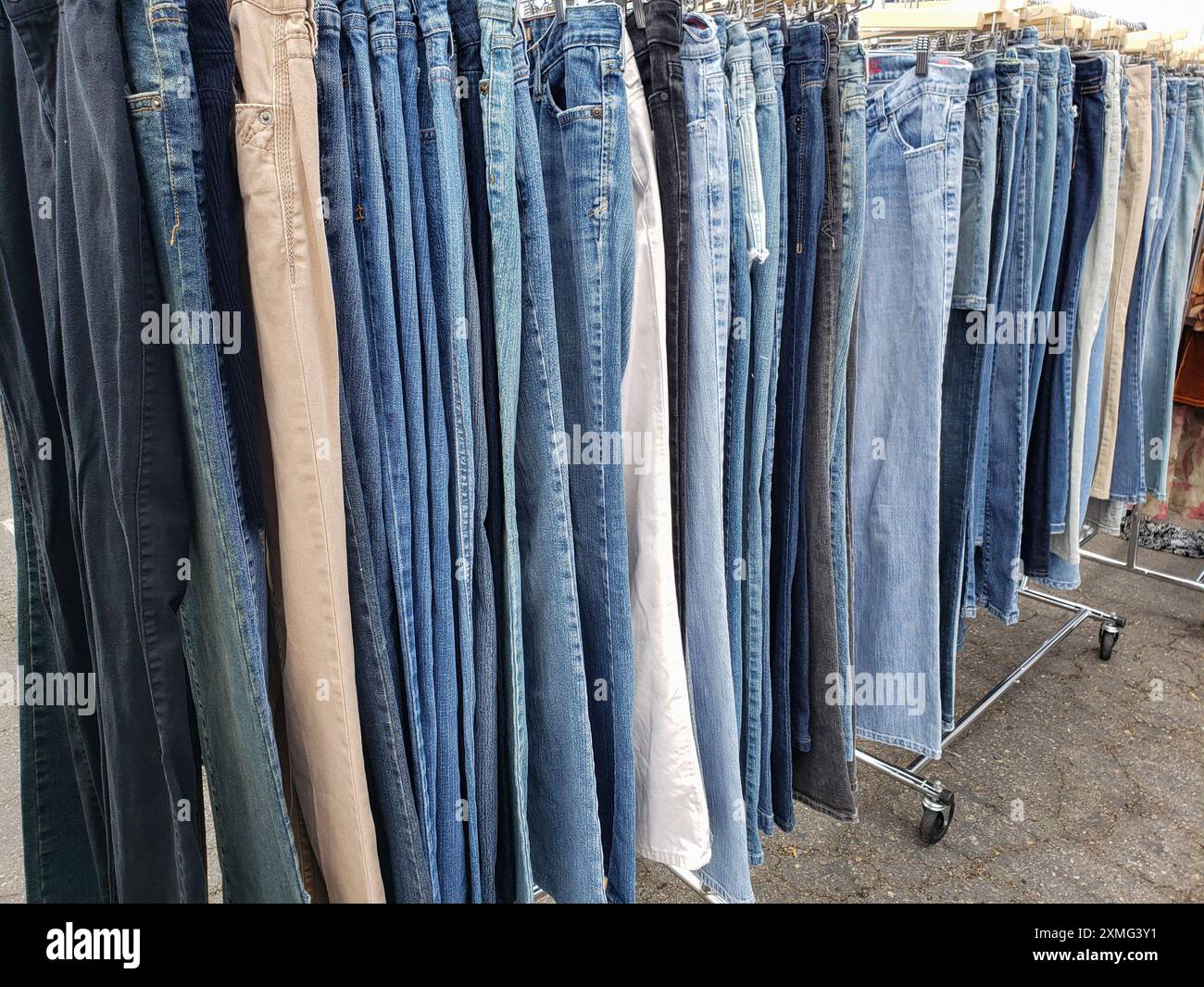 A view of several racks of jeans, as a background Stock Photo - Alamy