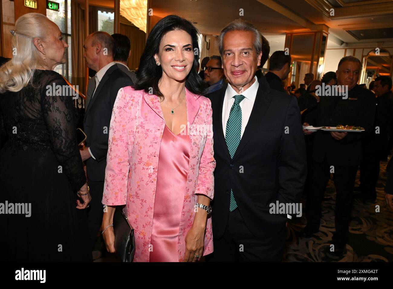 Gabriela Teissier, on left, and Oswaldo Borraez attend the 76th L.A ...