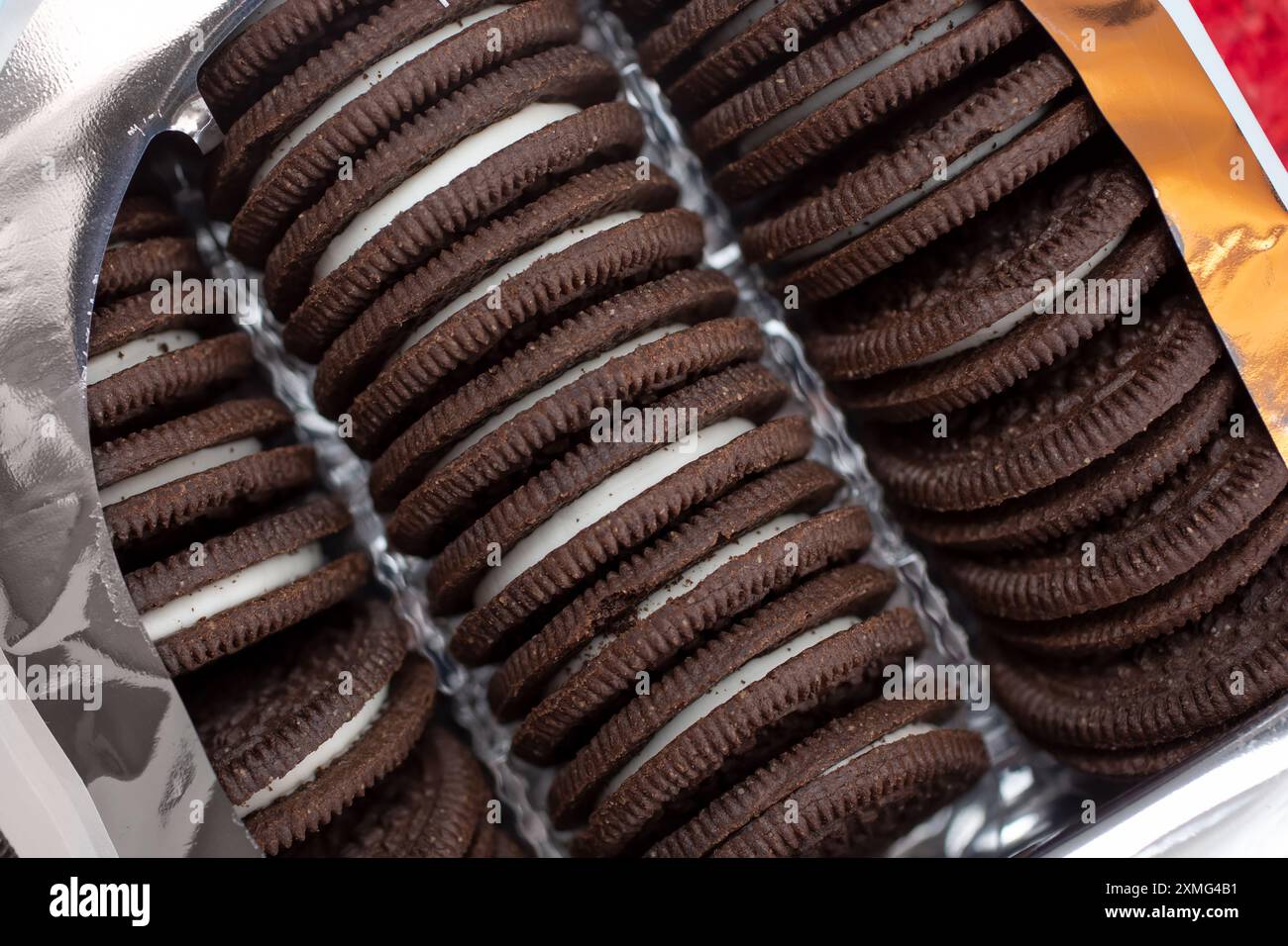 A top down view of chocolate sandwich cookies inside its package tray ...