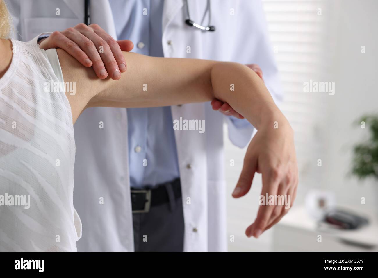 Sports injury. Doctor examining patient in hospital, closeup Stock ...