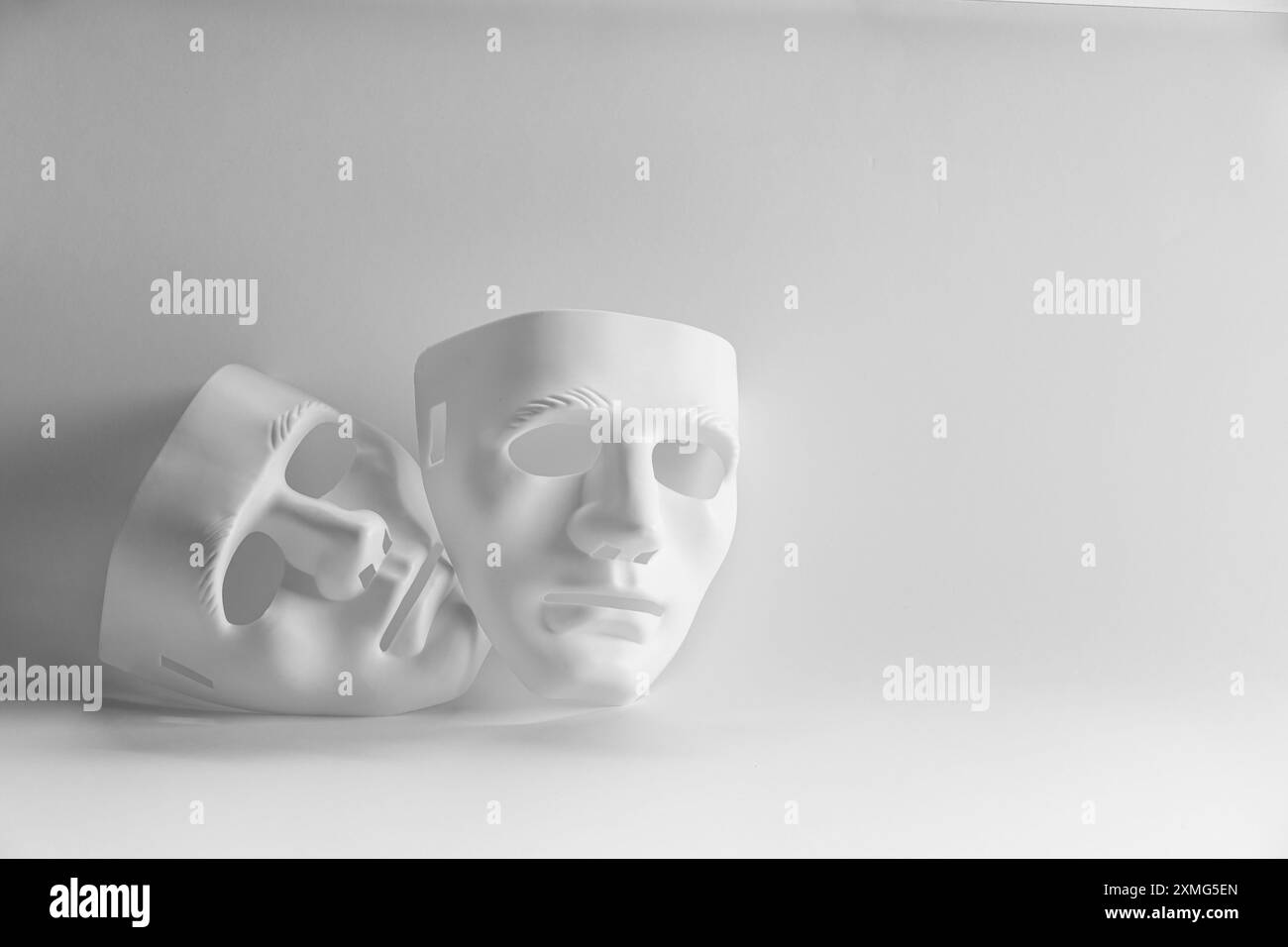 Plastic face masks on white background, space for text. Theatrical ...
