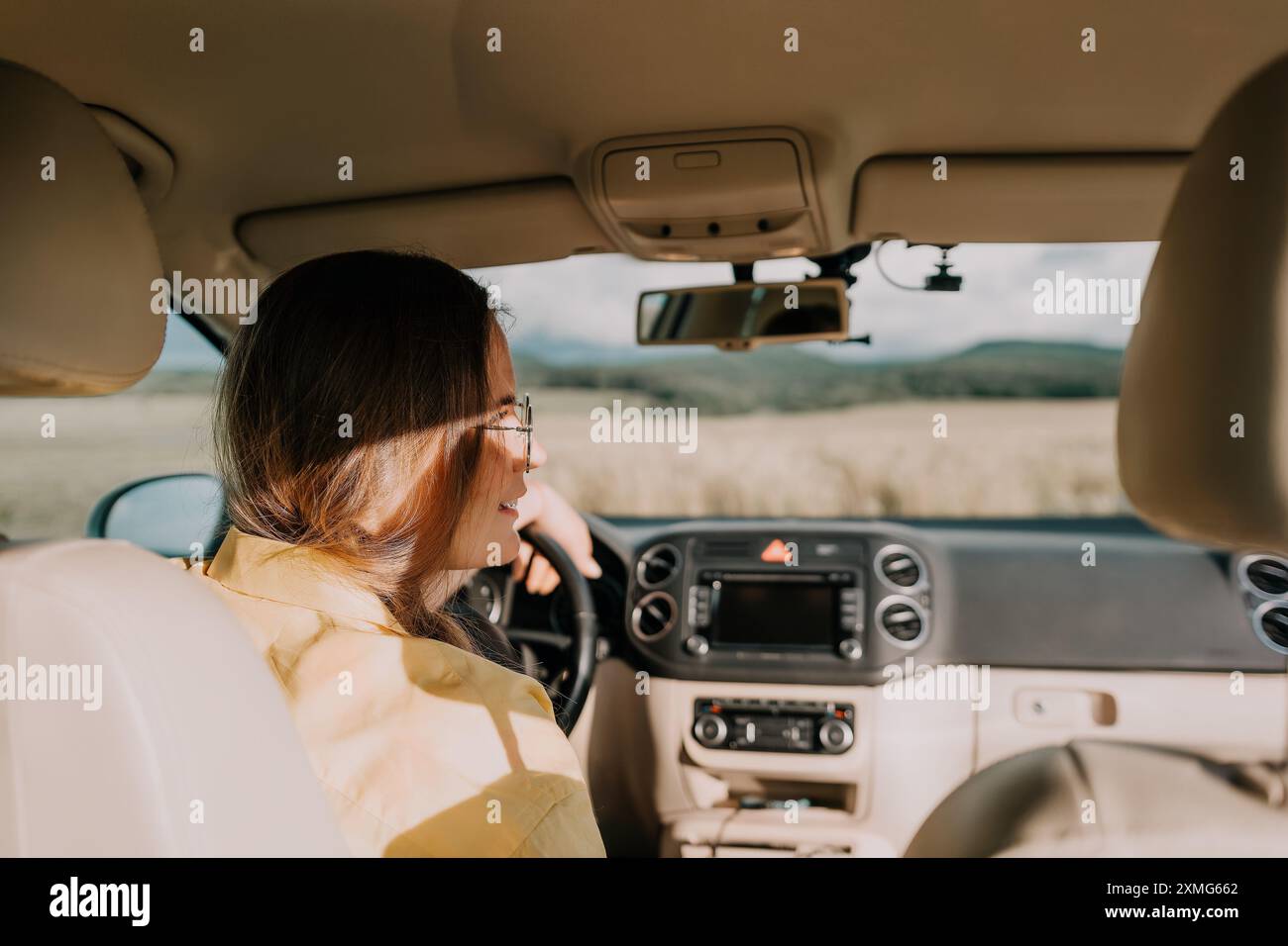Woman happy driving car horizon hi-res stock photography and images - Alamy