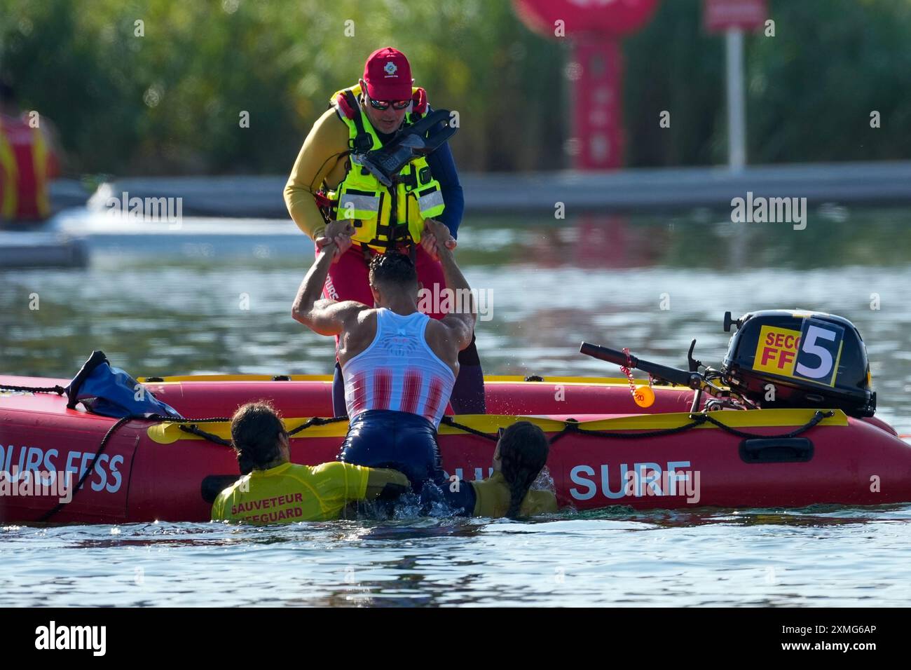 Javier Insfran, of Paraguay, is helped into a rescue boat during the ...