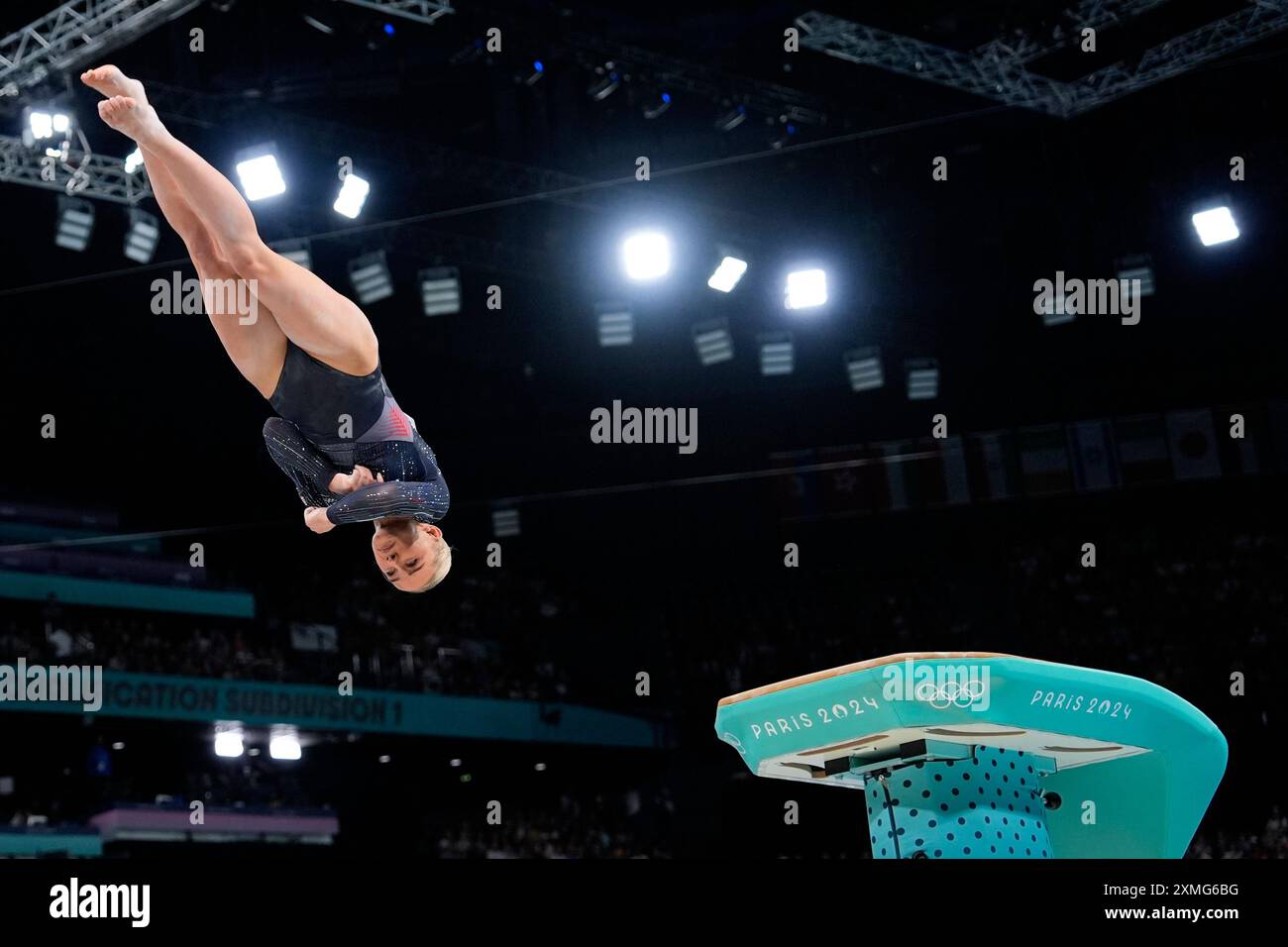 Ruby Evans, of Great Britain, competes on the vault during a women's ...