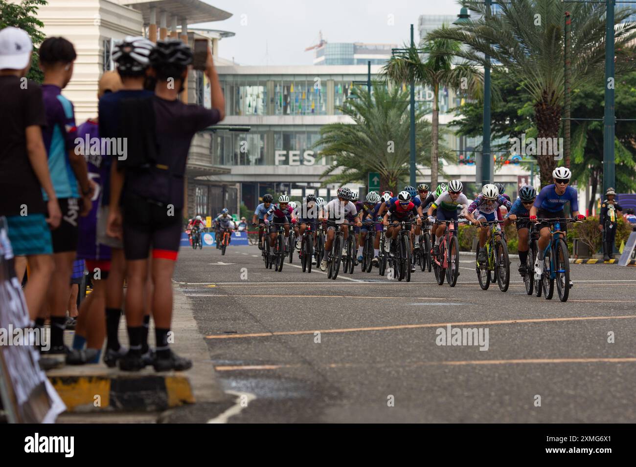 Iloilo City, Philippines. 28th July, 2024. A group of cyclists during a ...