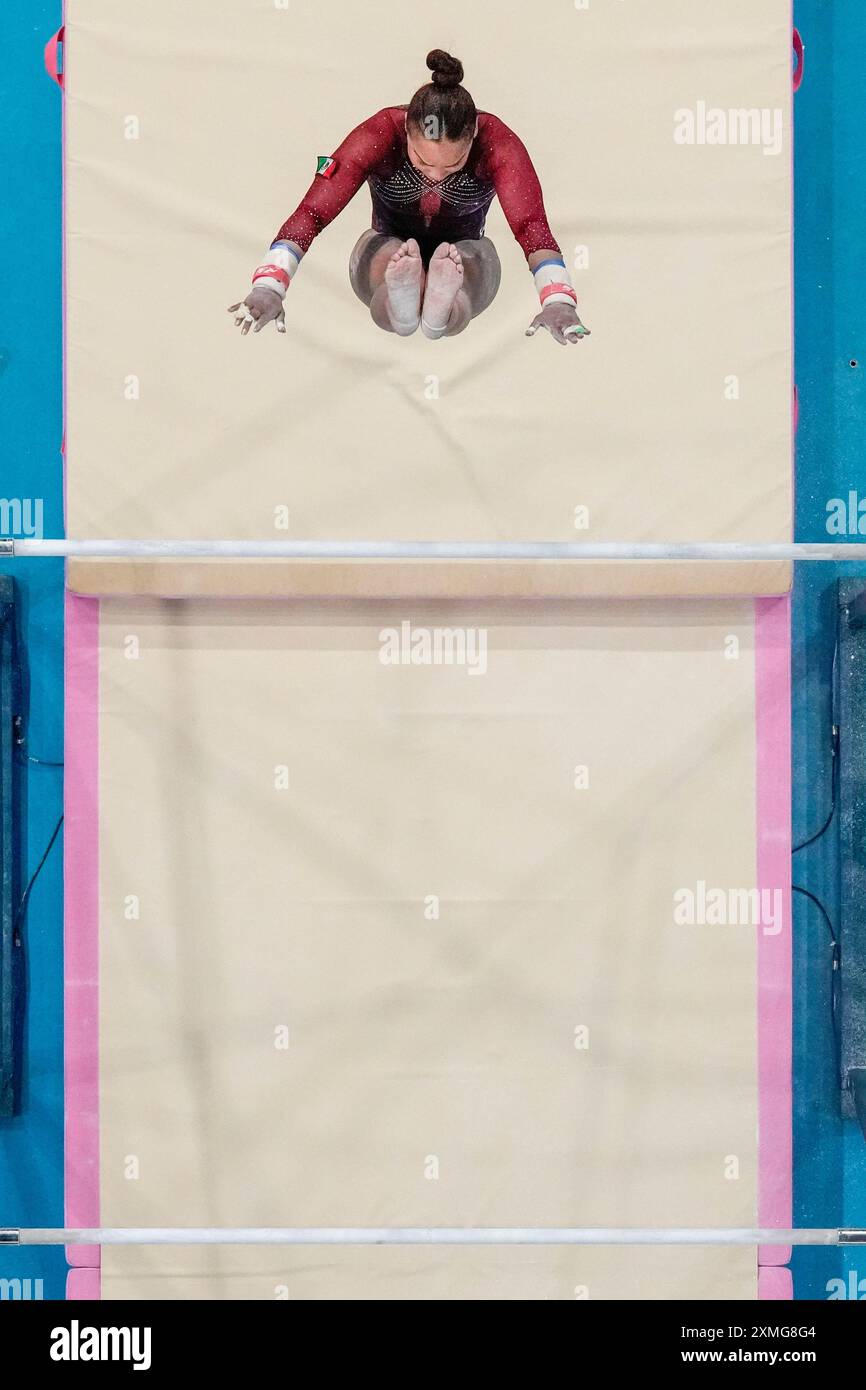 Natalia Escalera, of Mexico, performs on the uneven bars during a women ...