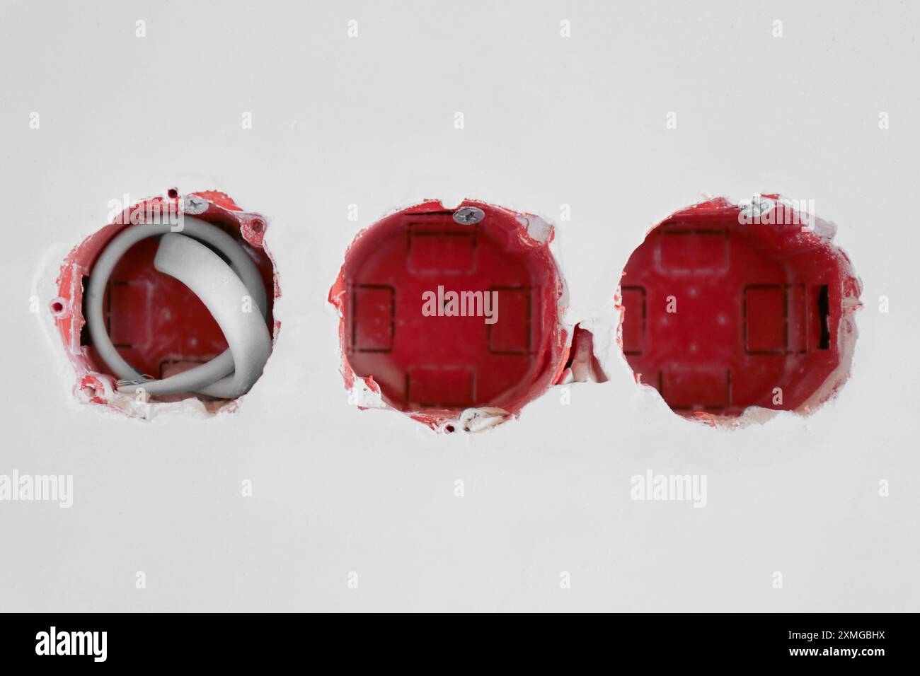 Holes for socket in wall with cables indoors. Installation of ...