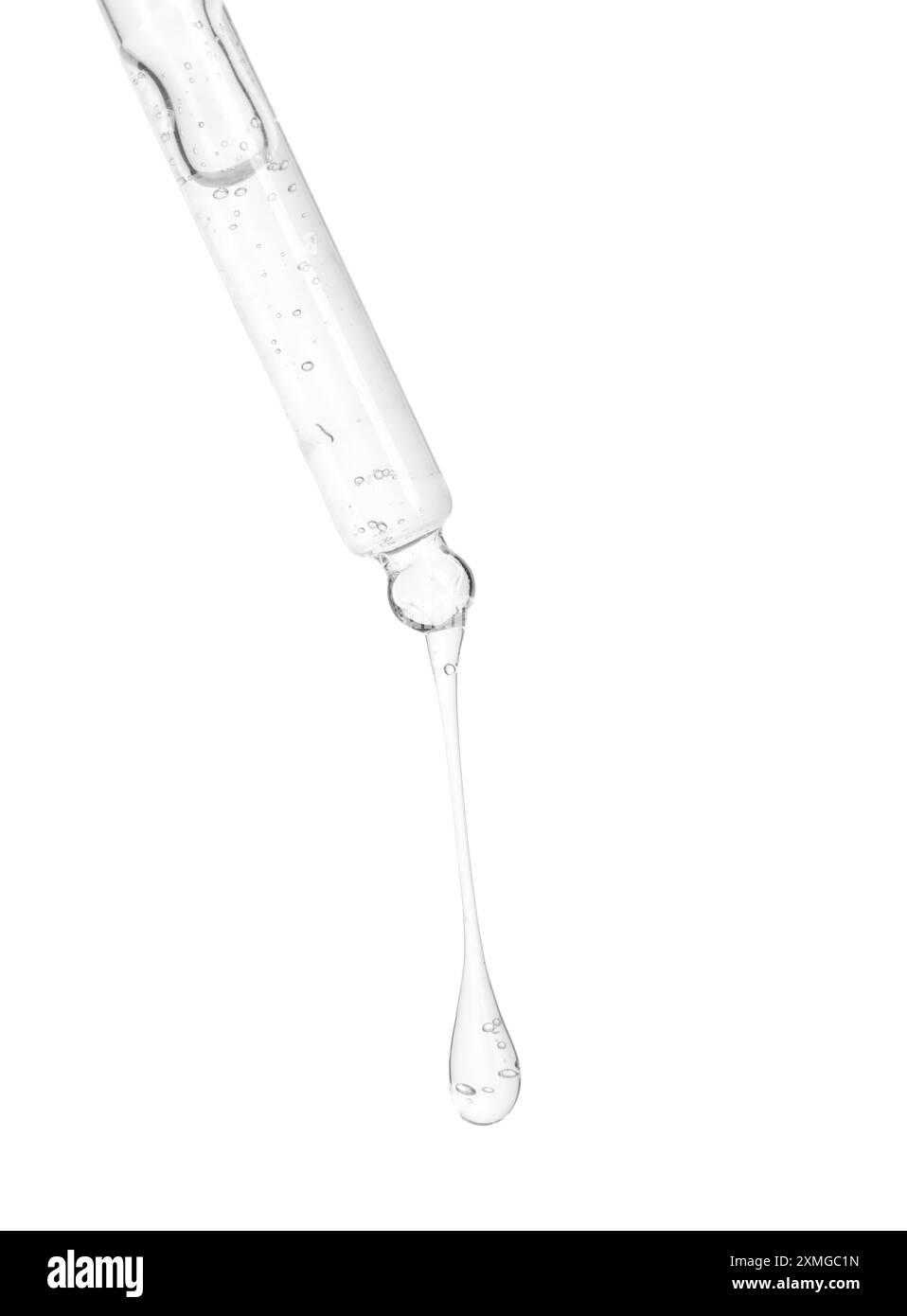 Dripping cosmetic serum from pipette on white background Stock Photo ...