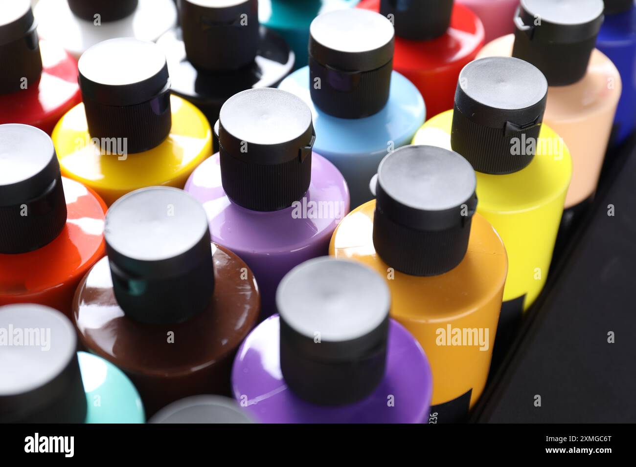 Acrylic paints of different colors in bottles, closeup Stock Photo - Alamy