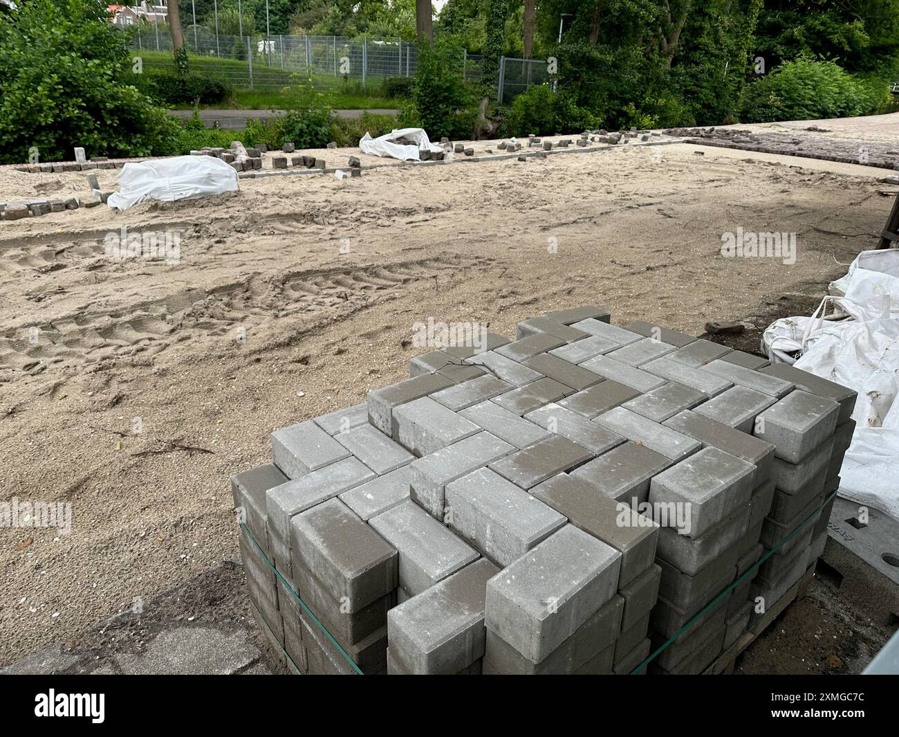 Process of laying paving stone blocks outdoors Stock Photo - Alamy