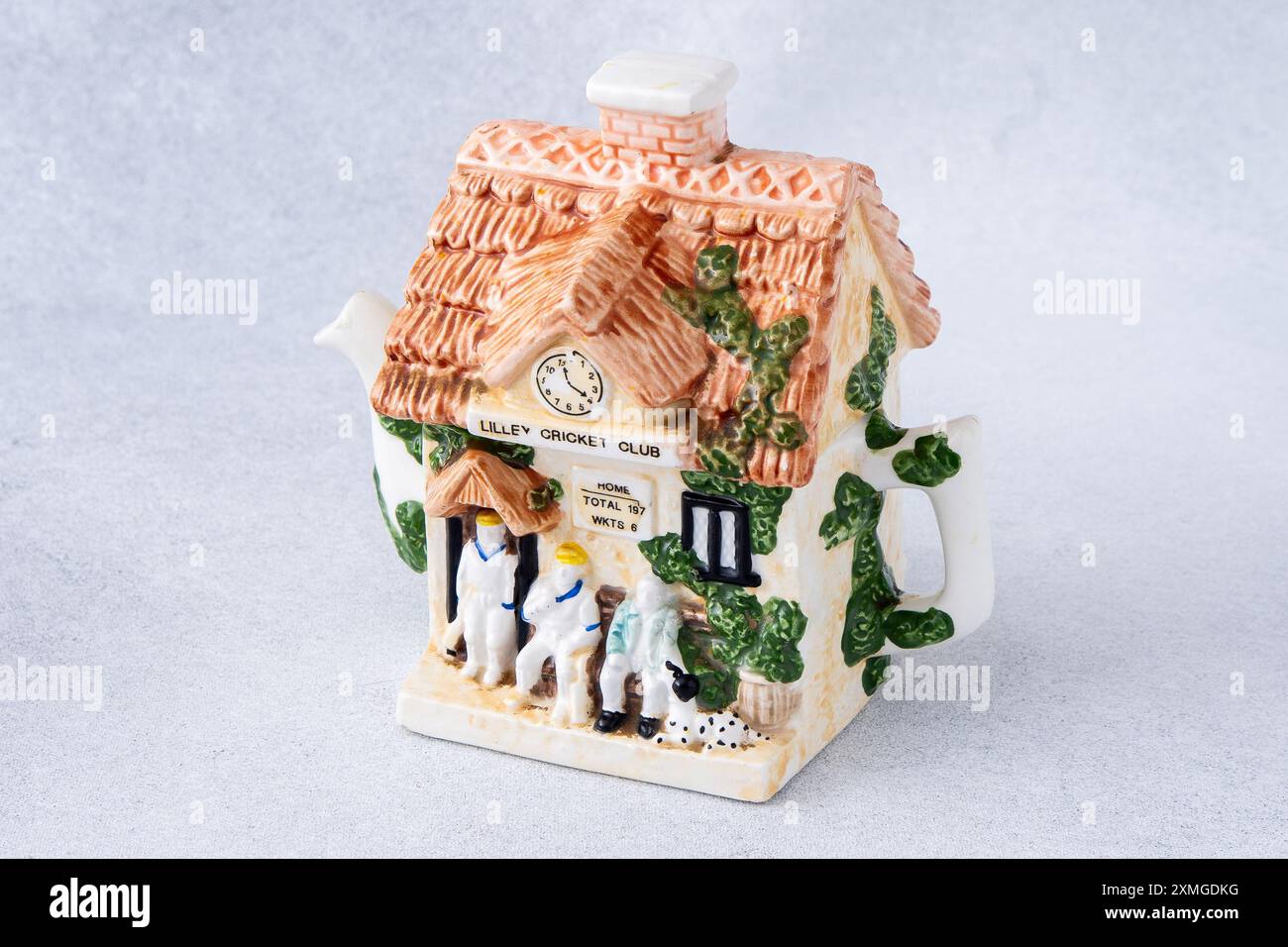 A kettle in the shape of a house. Antique porcelain tea pot Stock Photo ...