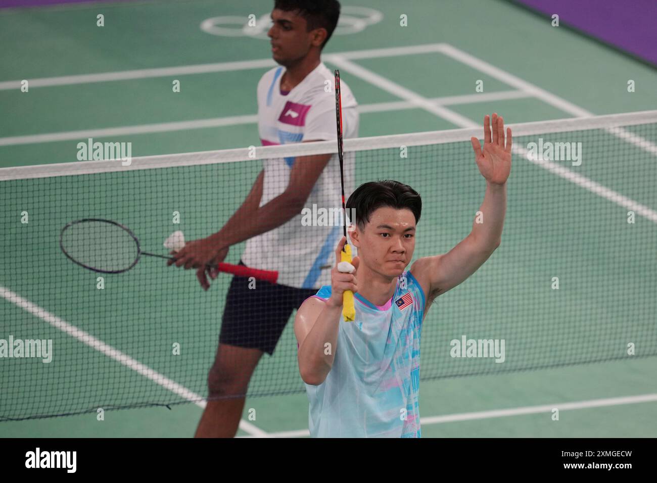 Malaysia's Lee Zii Jia, front, celebrates as he plays against Sri ...