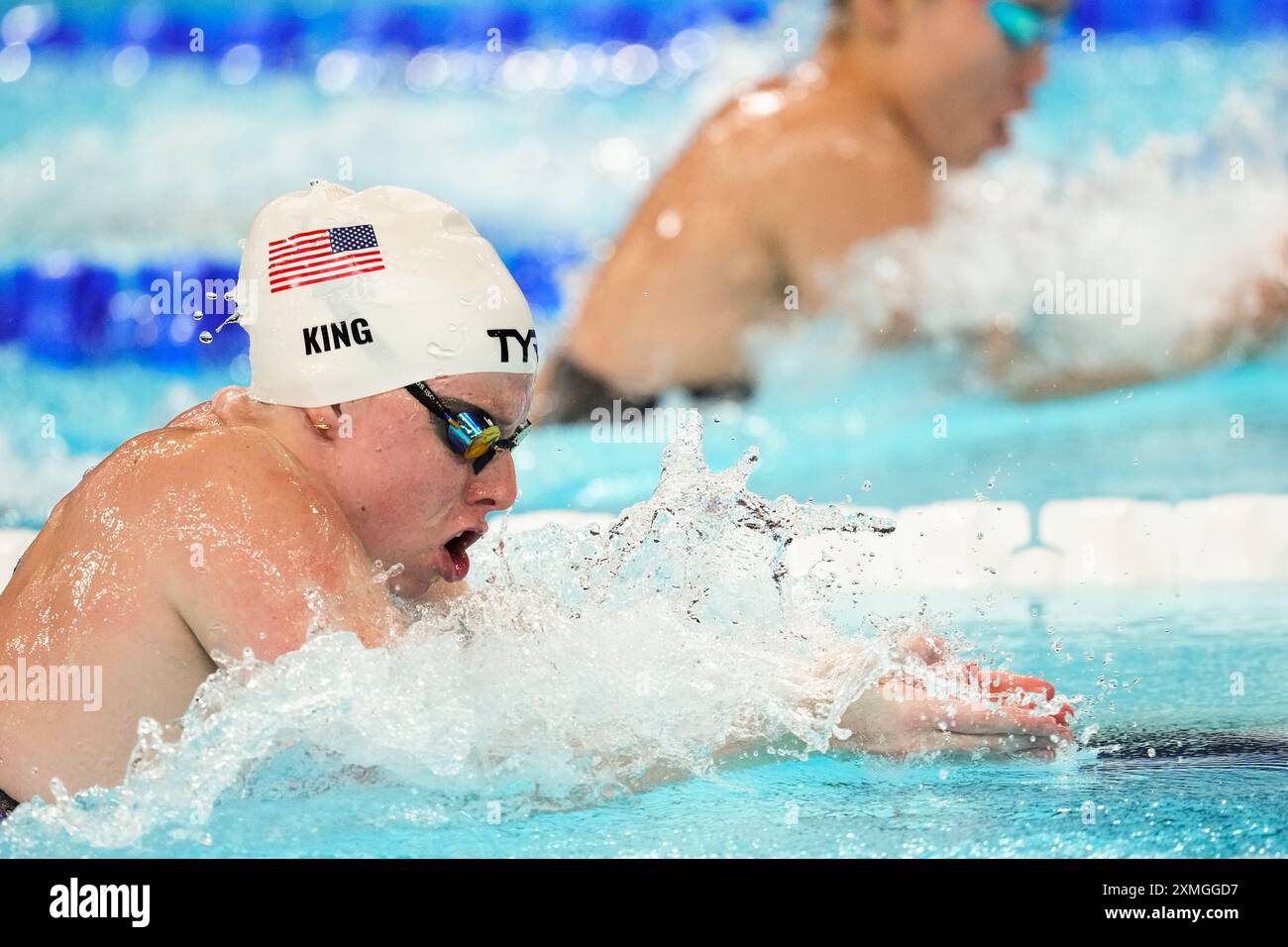 Lilly King, left, of the United States, competes during a heat in the ...