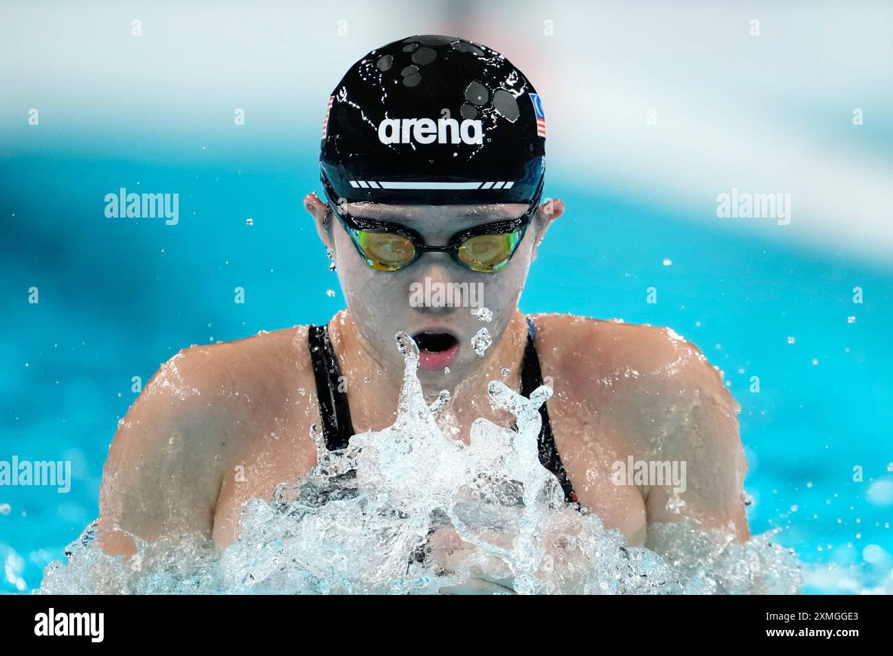 Rouxin Tan, of Malaysia, competes during a heat in the women's 100 ...