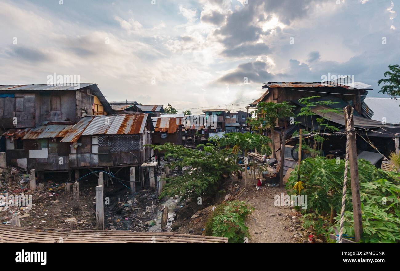 Life amidst challenges in a philippine slum community surrounded by ...