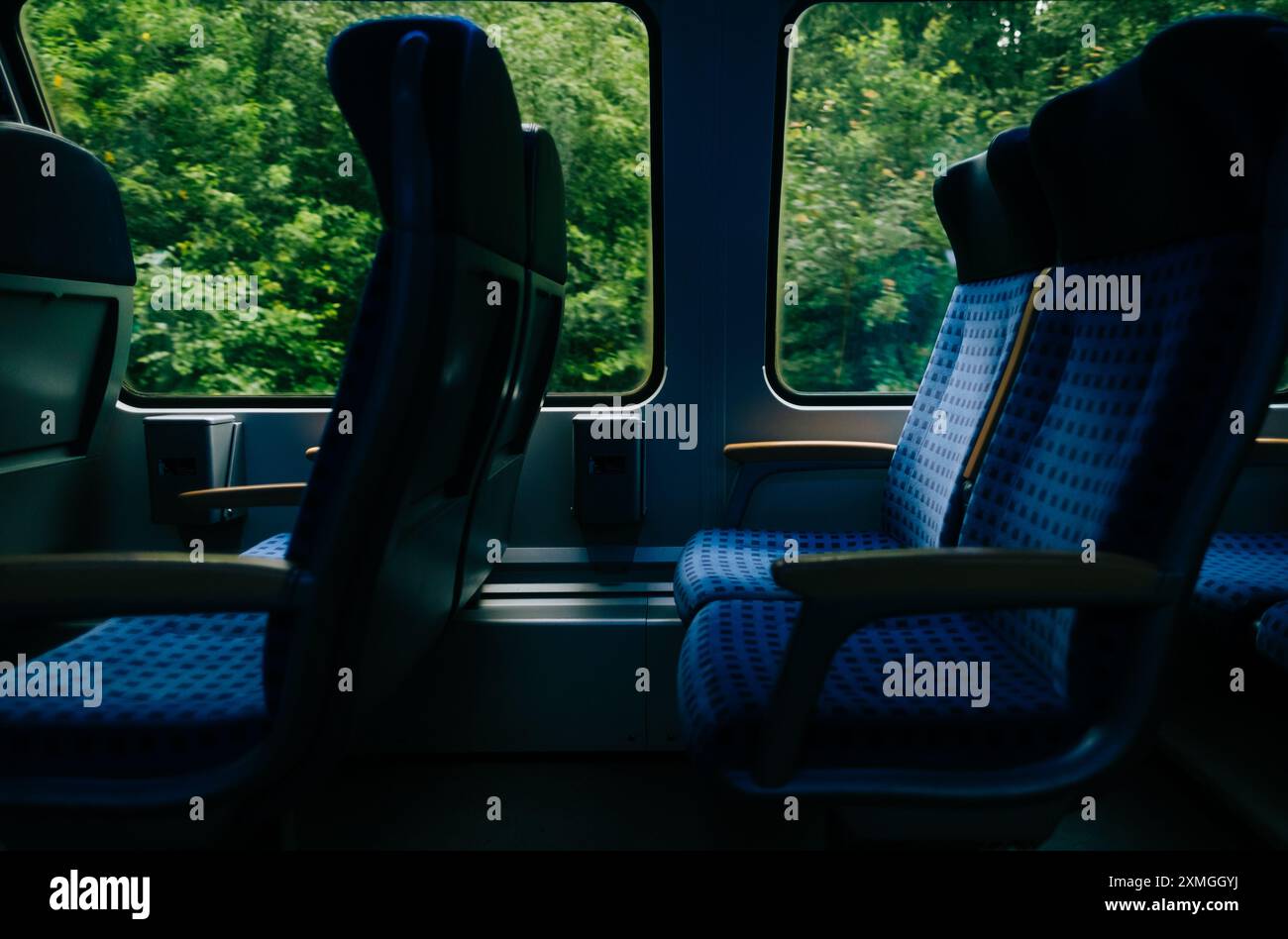 Interior detail of German regional train, large window and empty seats ...