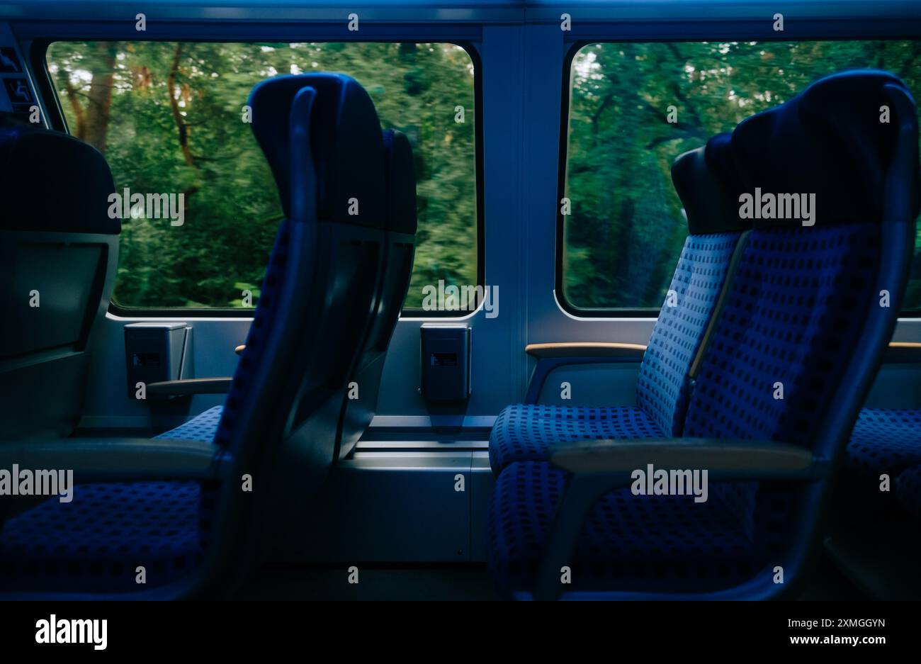Interior detail of German regional train, large window and empty seats ...