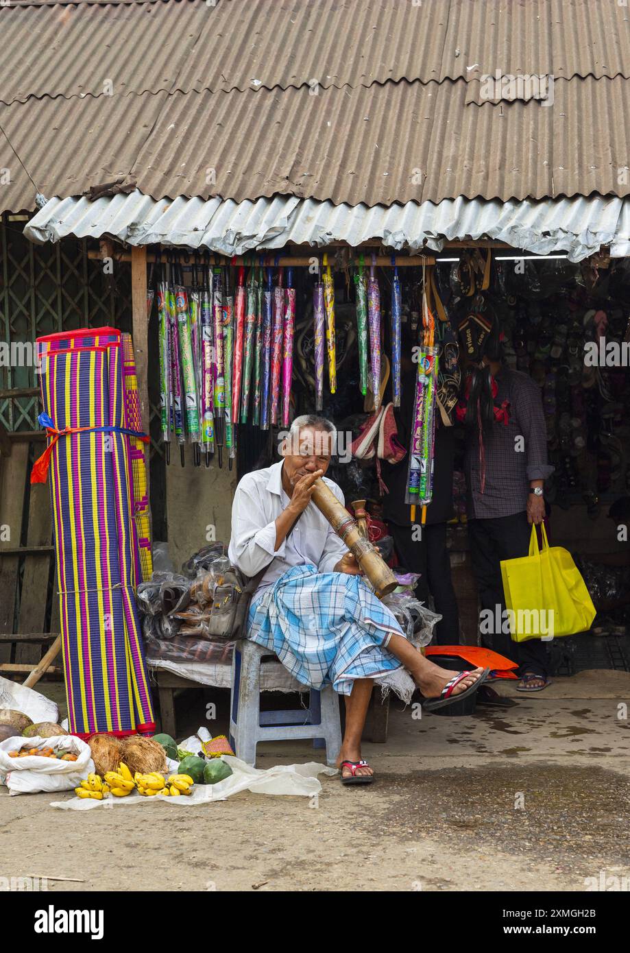 Chakma tribe man smoking bamboo pipe, Chittagong Division, Rangamati ...