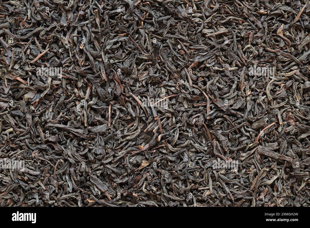 Long black tea, texture. Top view of dried tea leaves. Tea composition ...