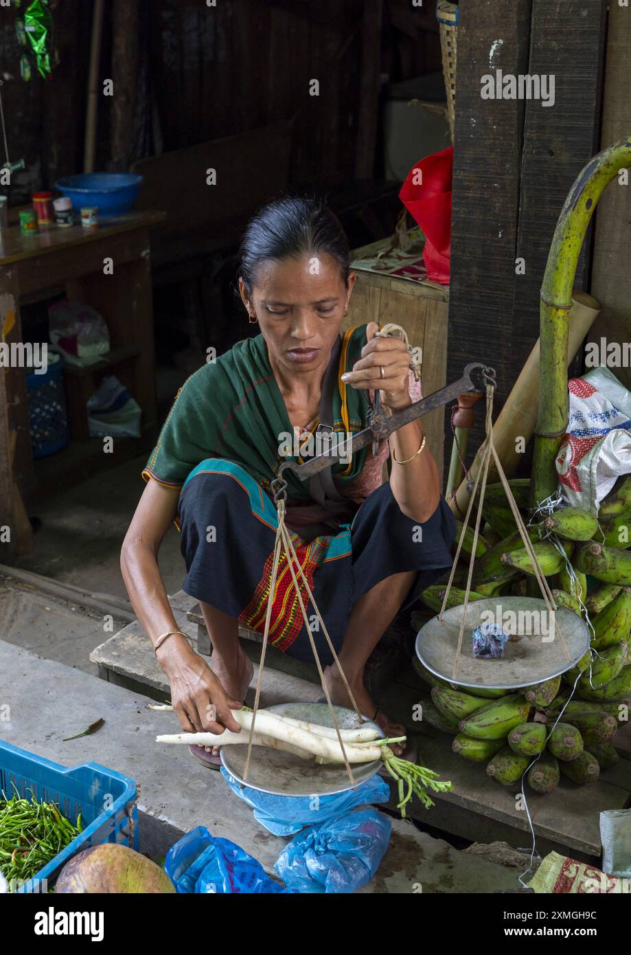 Chakma tribe woman selling vegetables at market, Chittagong Division ...