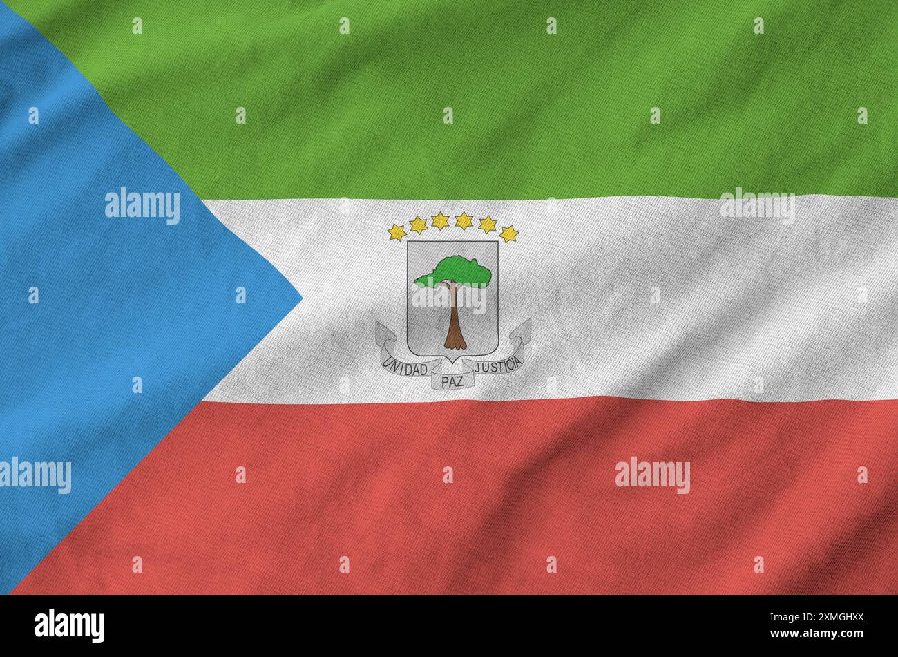 Equatorial Guinea flag depicted on folded wavy fabric of old cloth ...